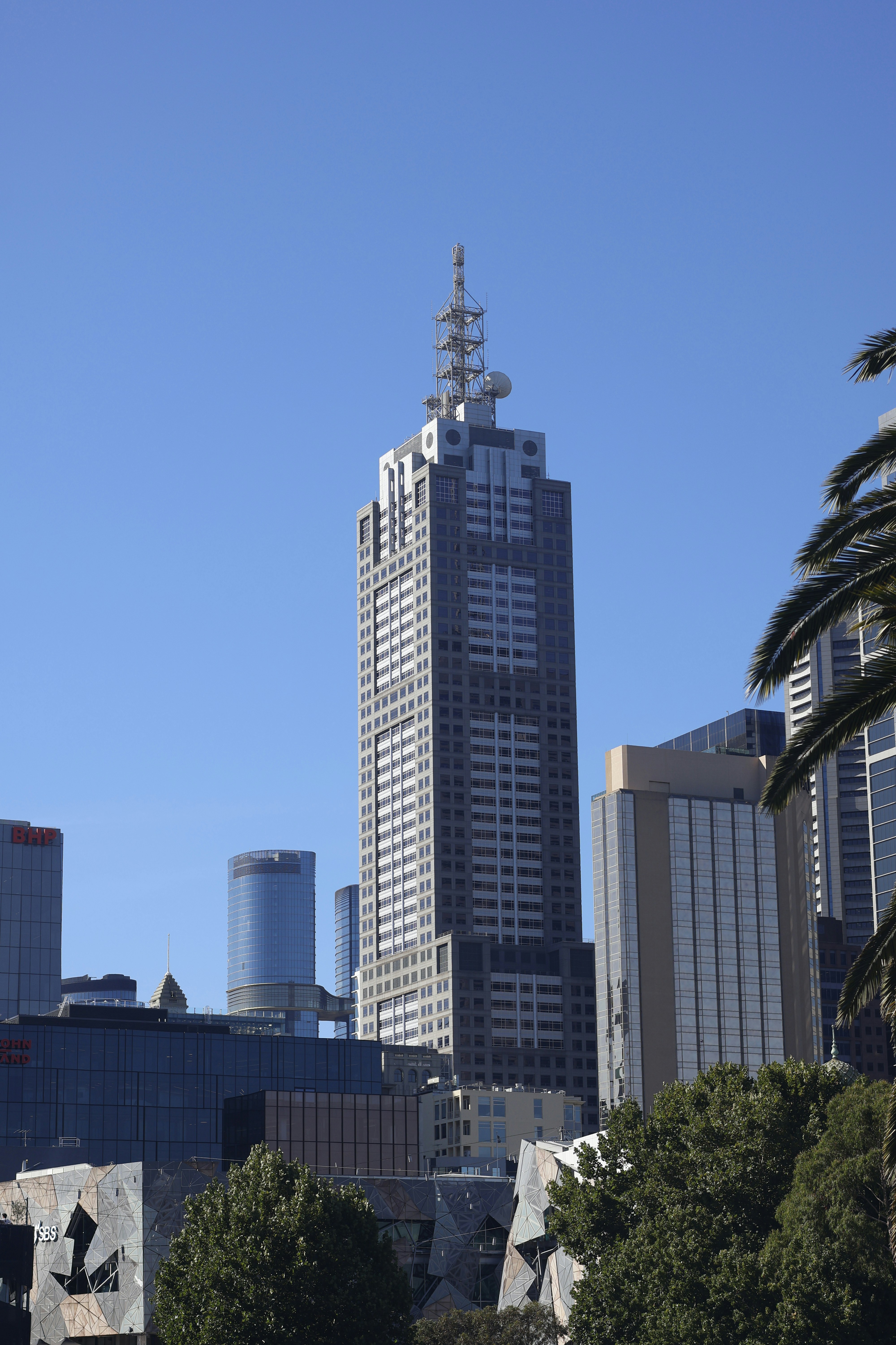 Skyline Sentinel: The Tall Tower Piercing a Clear Azure