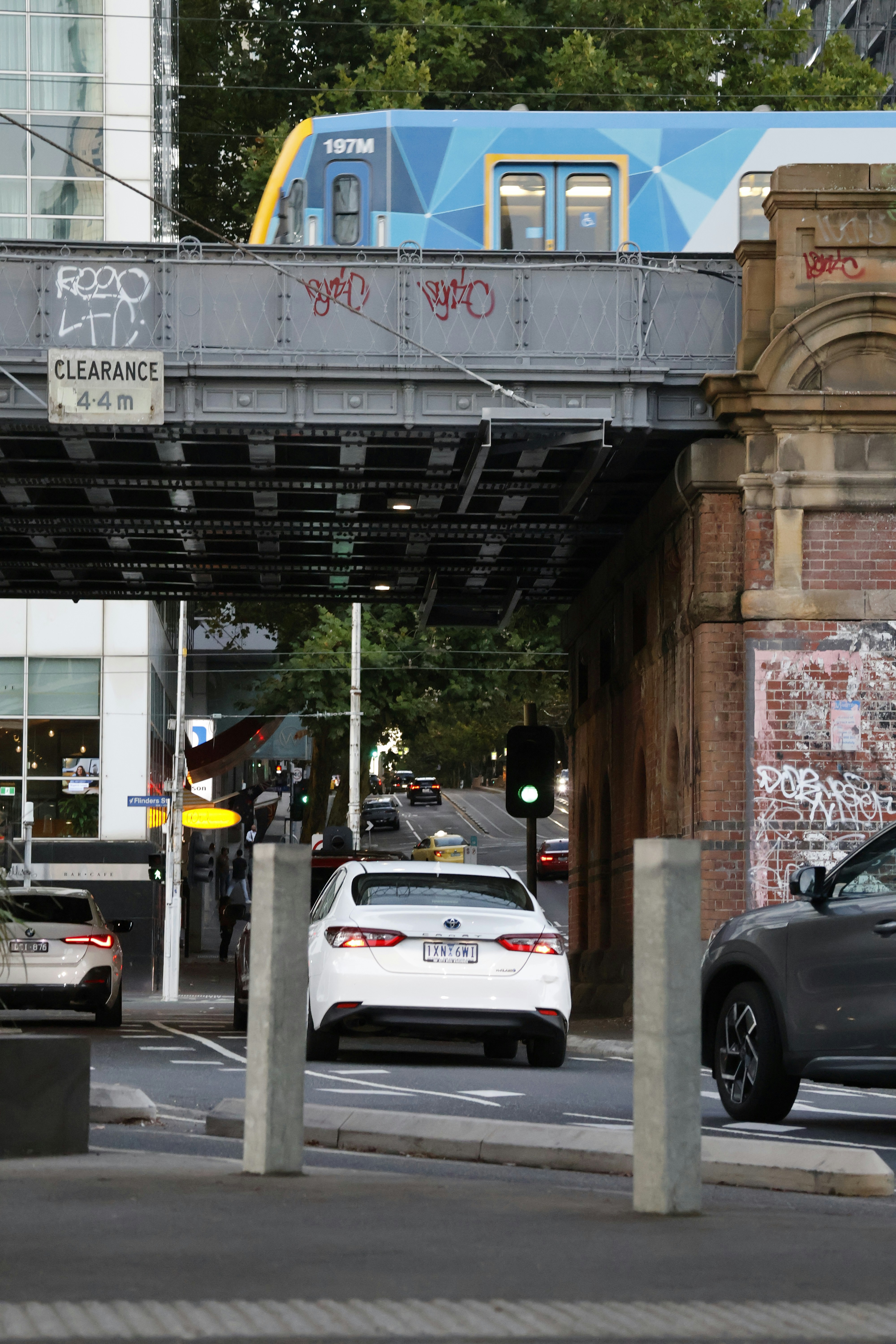 Urban Transit Overpass: A Train Rides Above the Street
