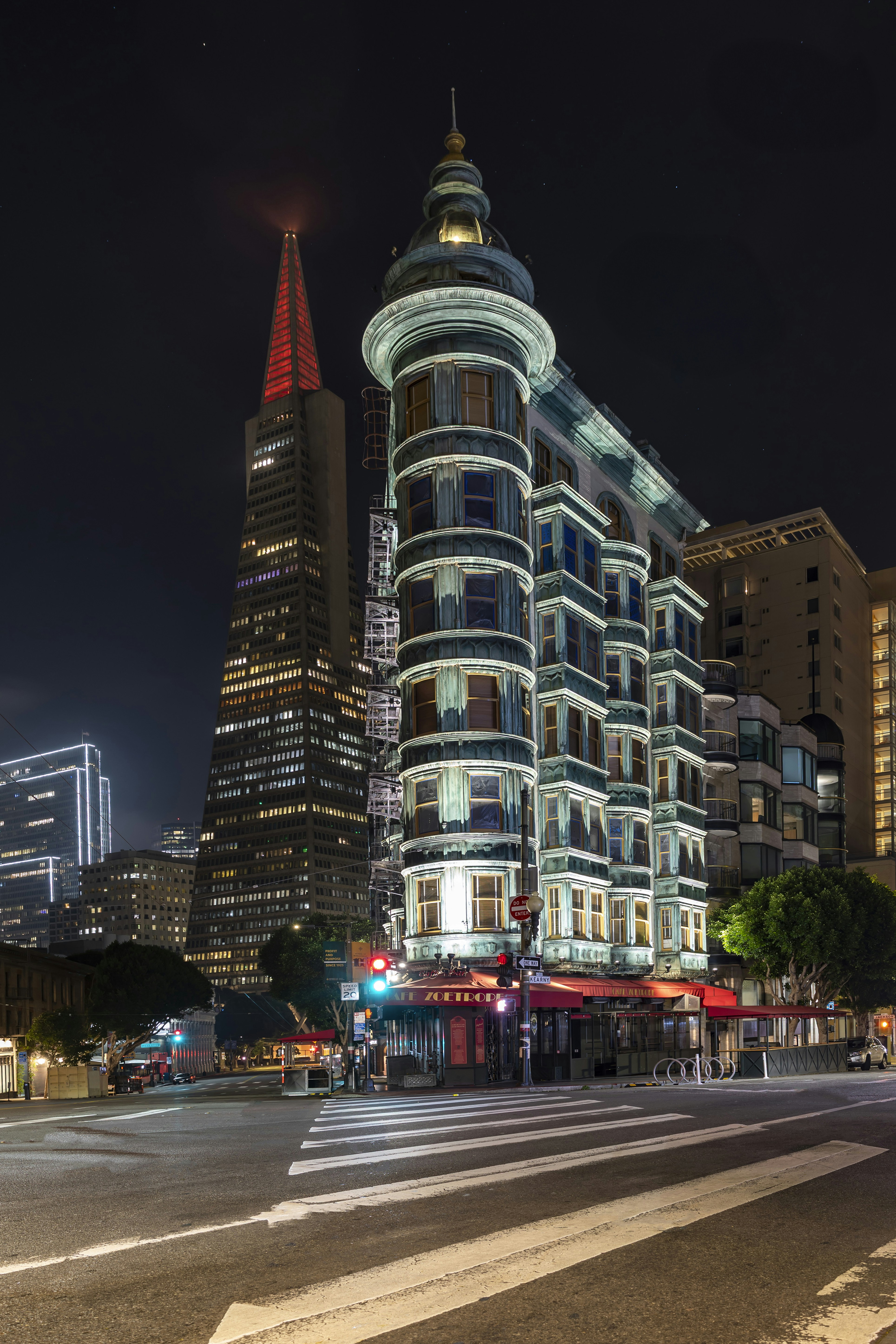 Historic building with transamerica pyramid at night.