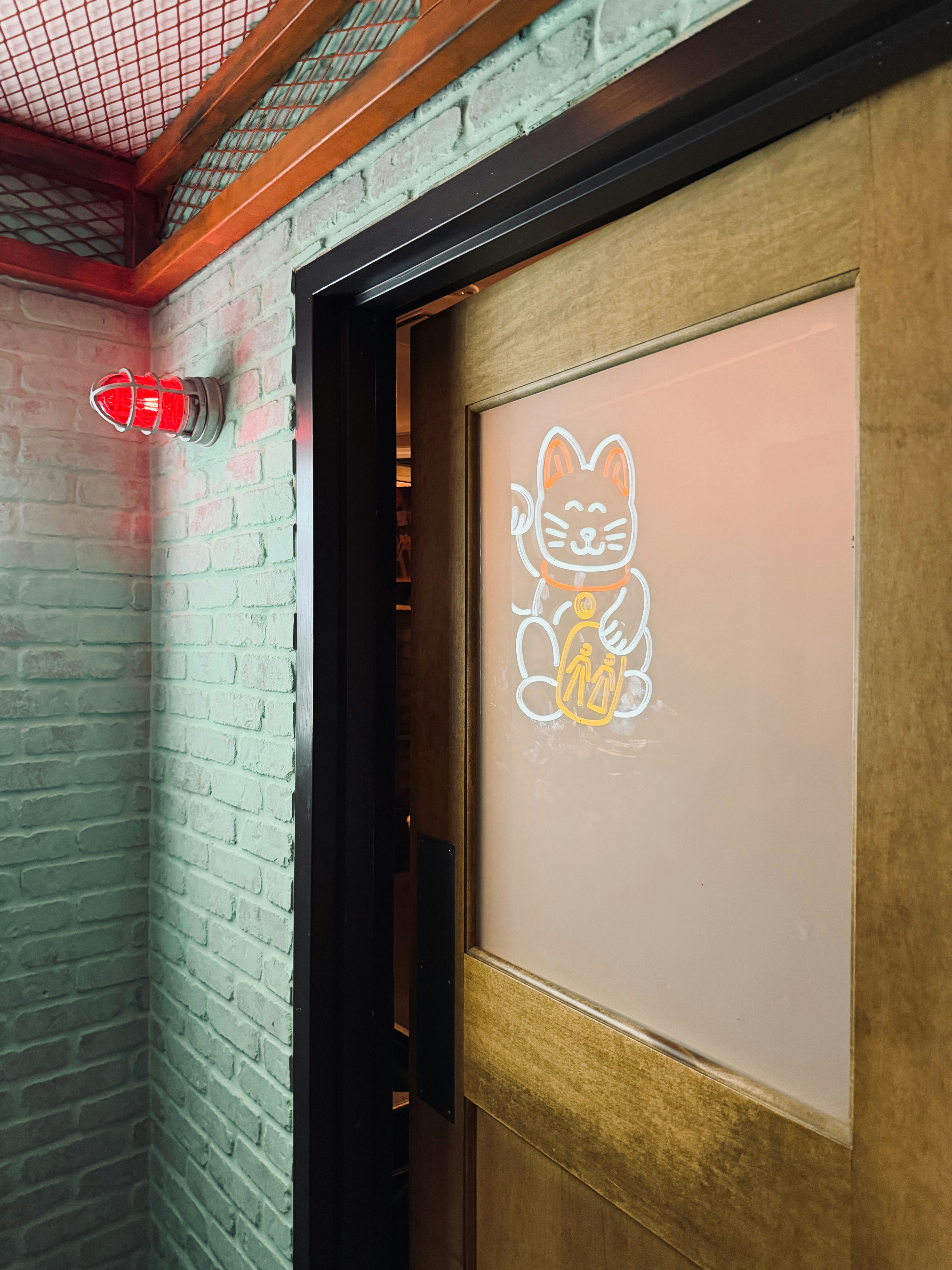Doorway Graffiti: A Friendly Cat Graces Frosted Glass