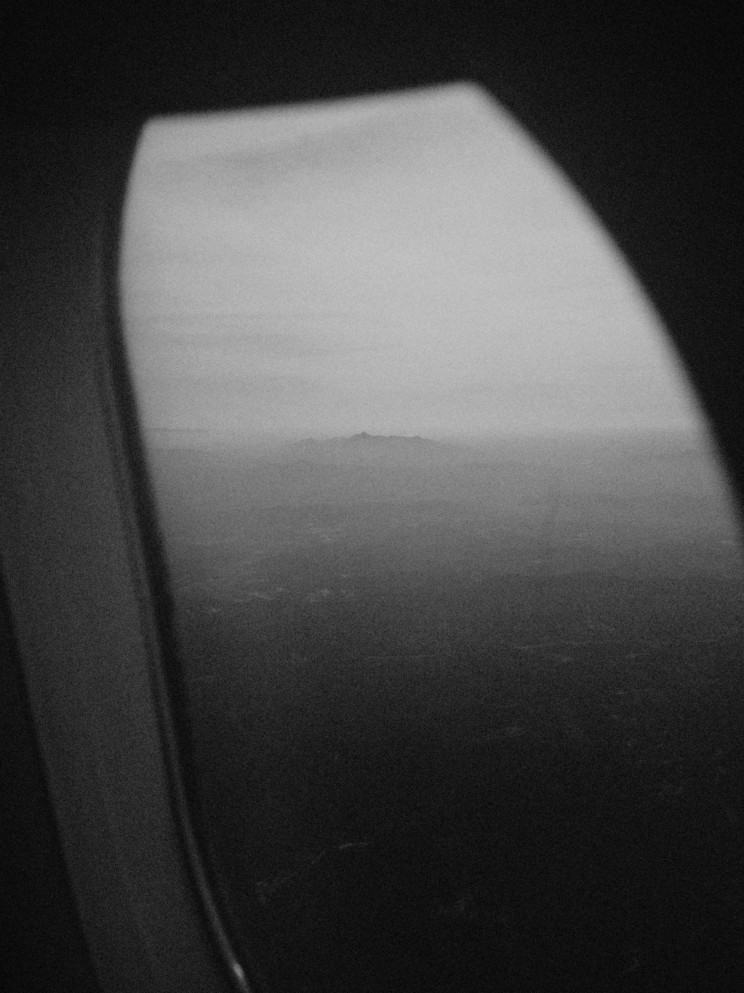 View of mountains through an airplane window