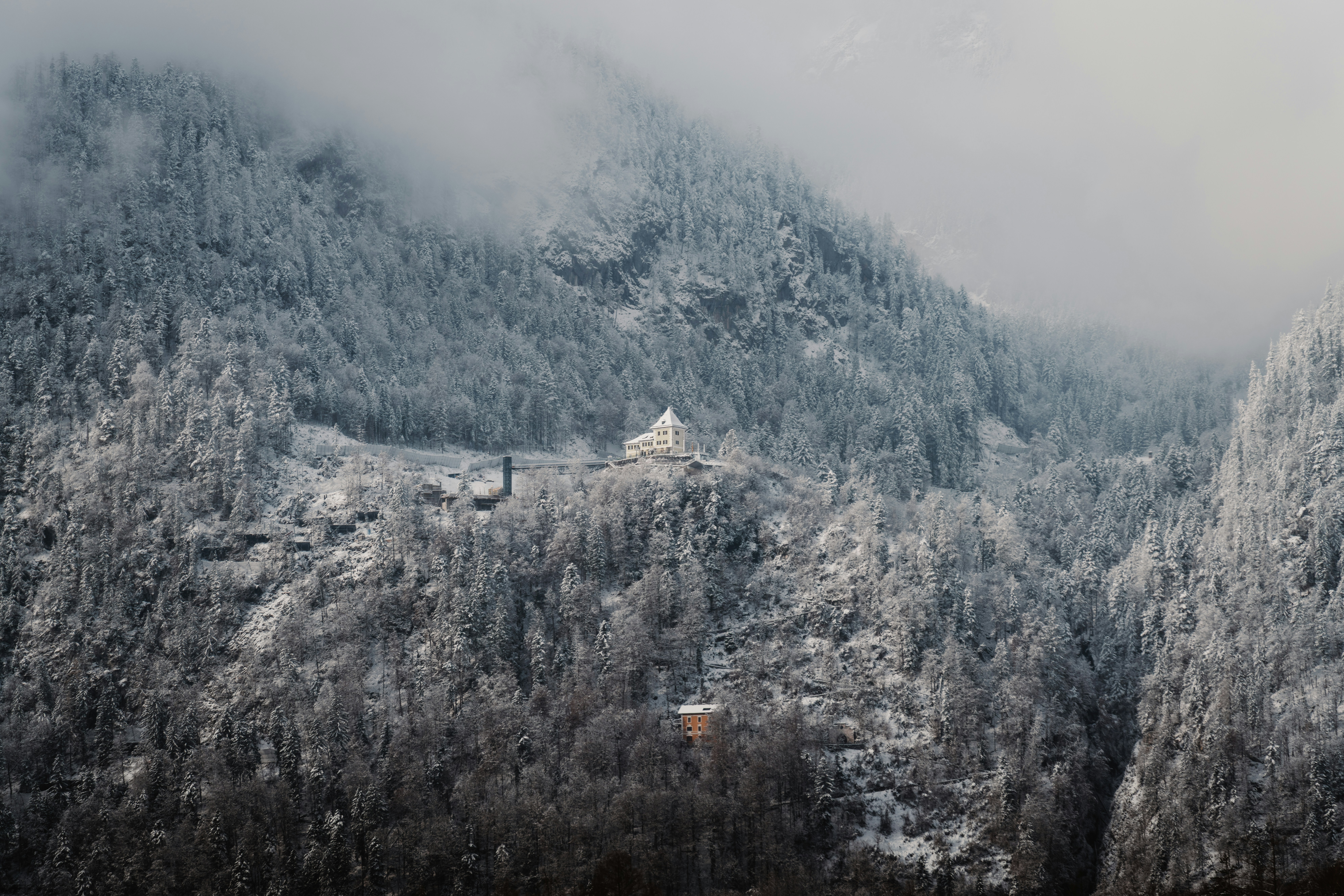 House on Snowy Mountain Slope