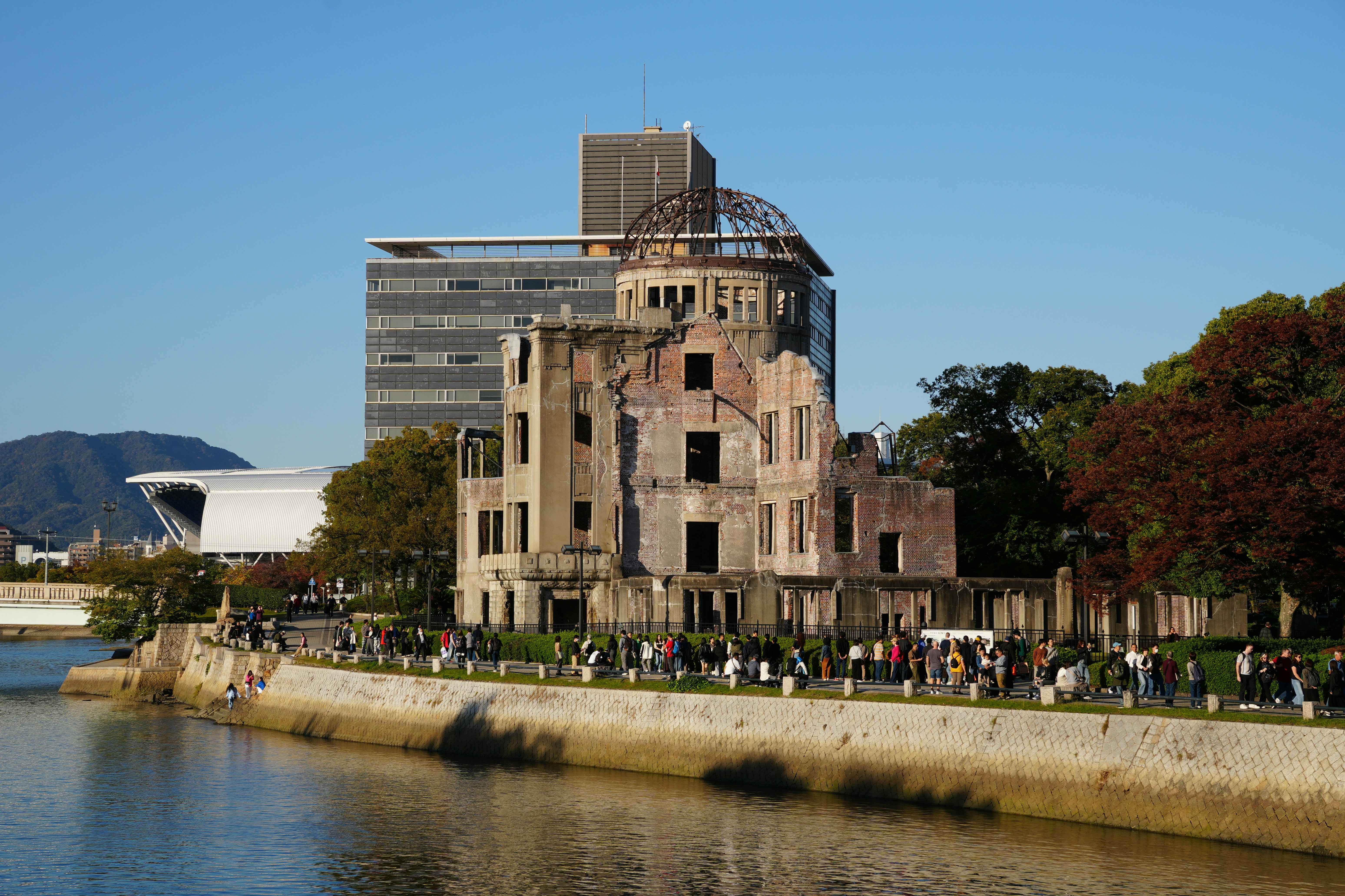 Memorial Ruin by the Riverside: People Stroll Along the Wake of History