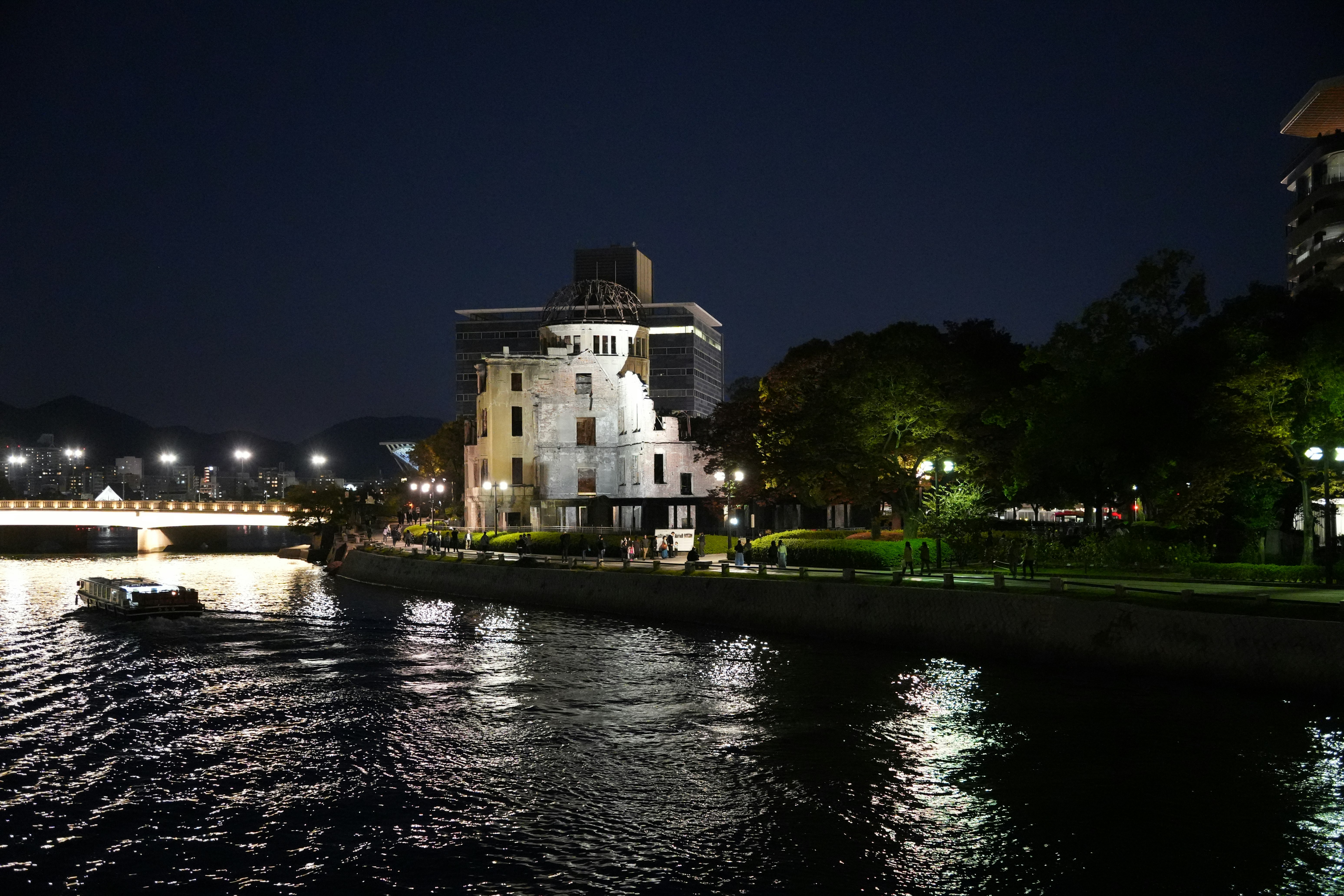 Midnight Riverside Bell Tower Under City Lights
