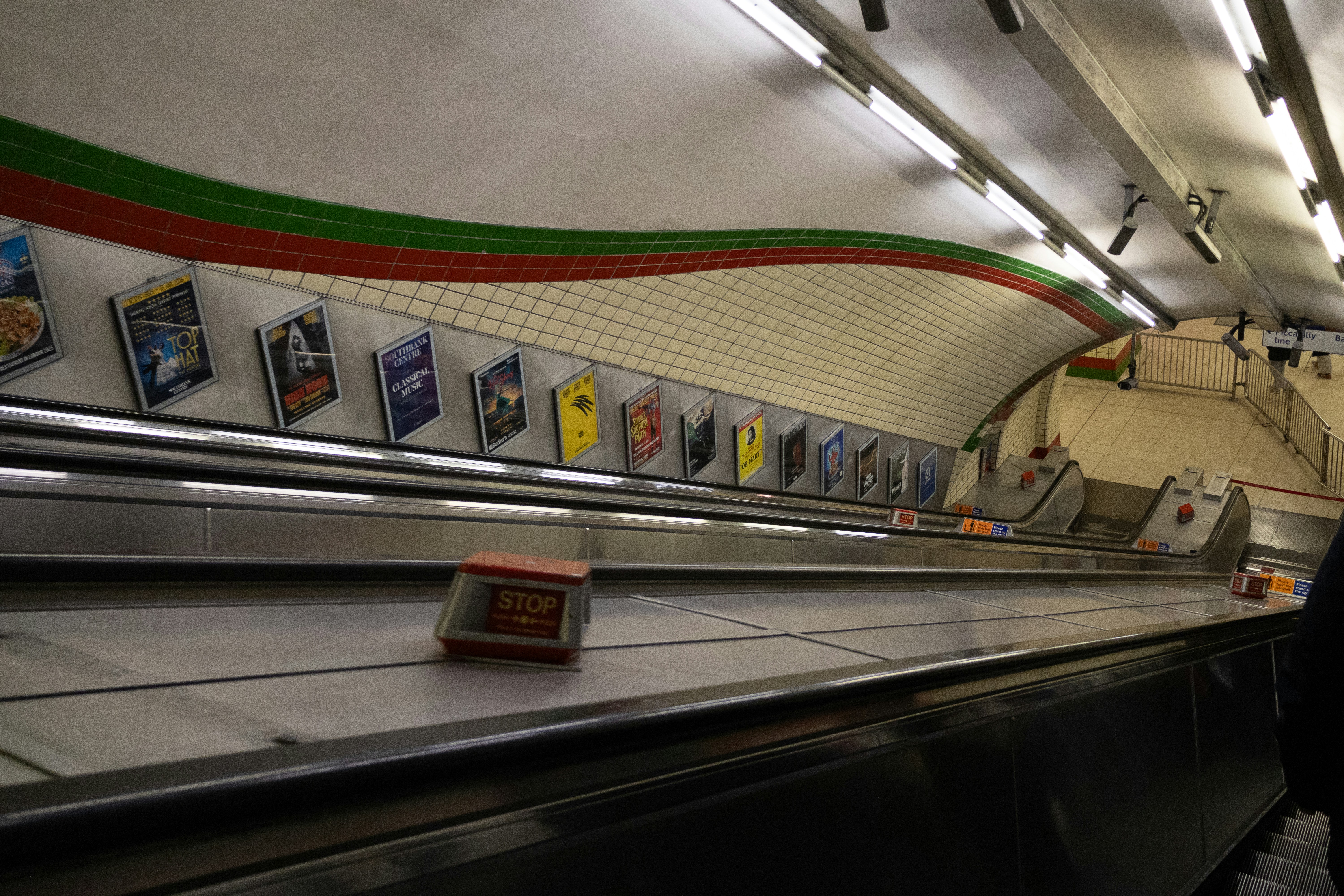 Undulating Tiles and Neon Rails: A Quiet Moment in the Subway Corridor