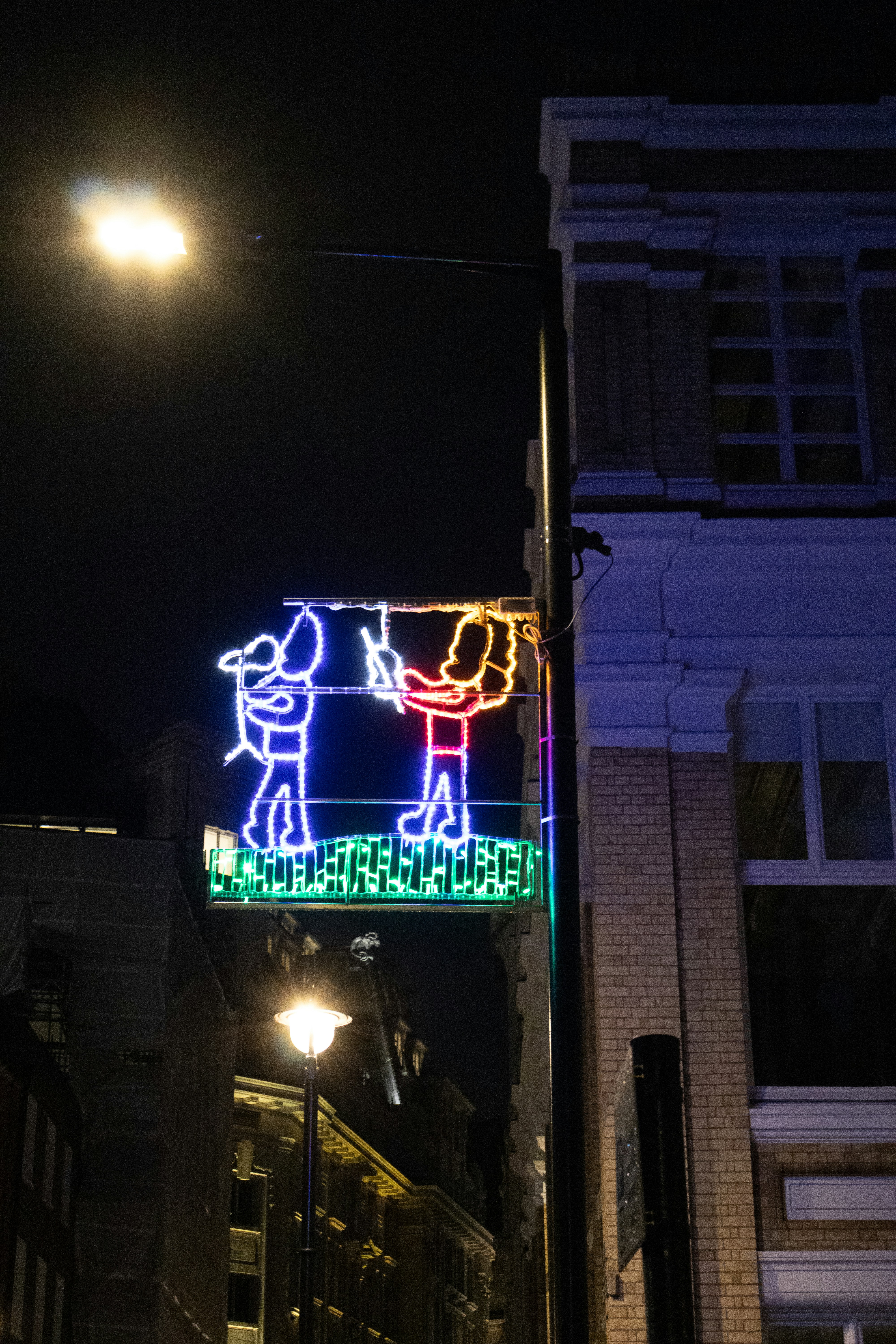 Neon Christmas Scene Over a Quiet Urban Street