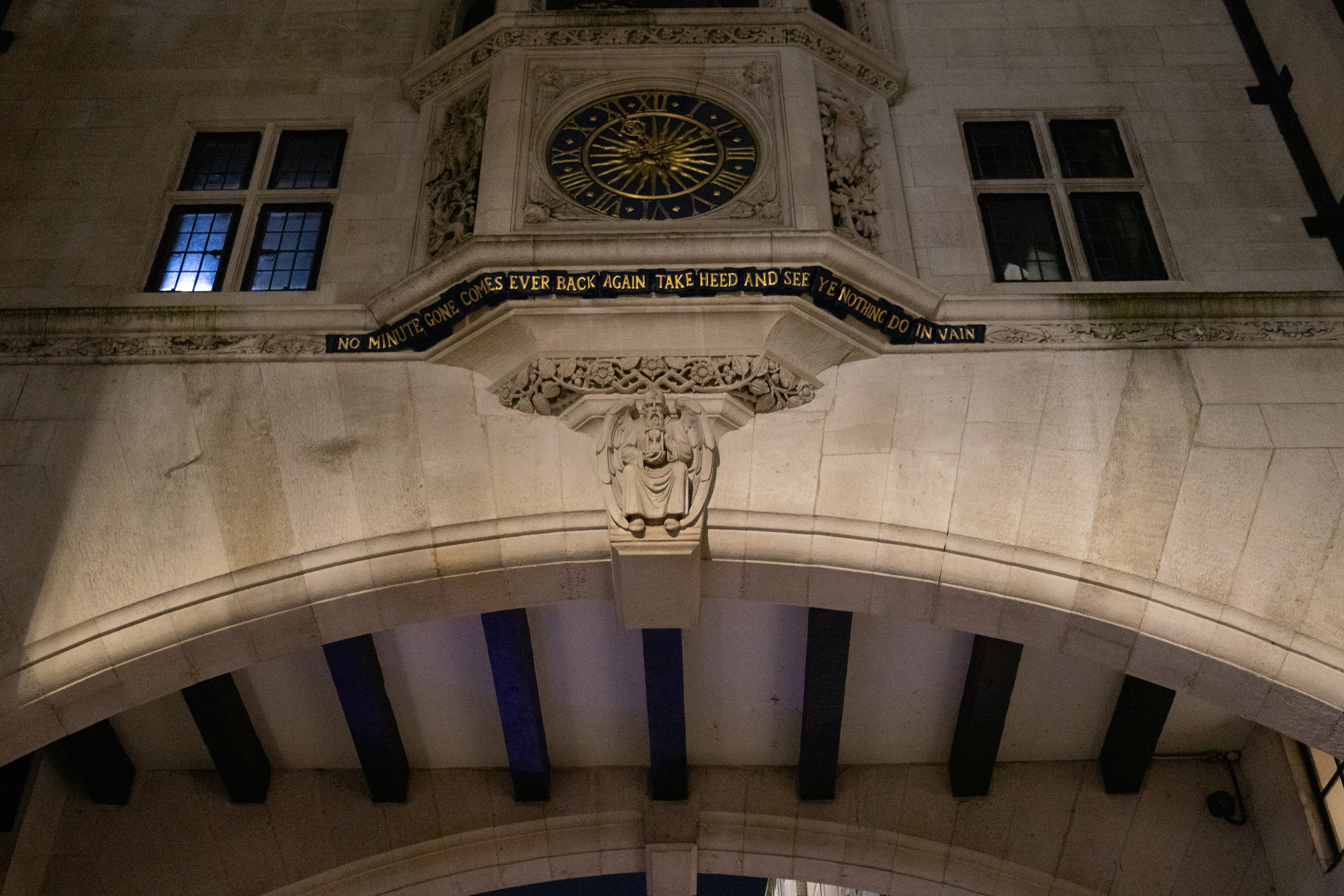 Architectural Clocktower Archway: Evening Light on Stone and Iron
