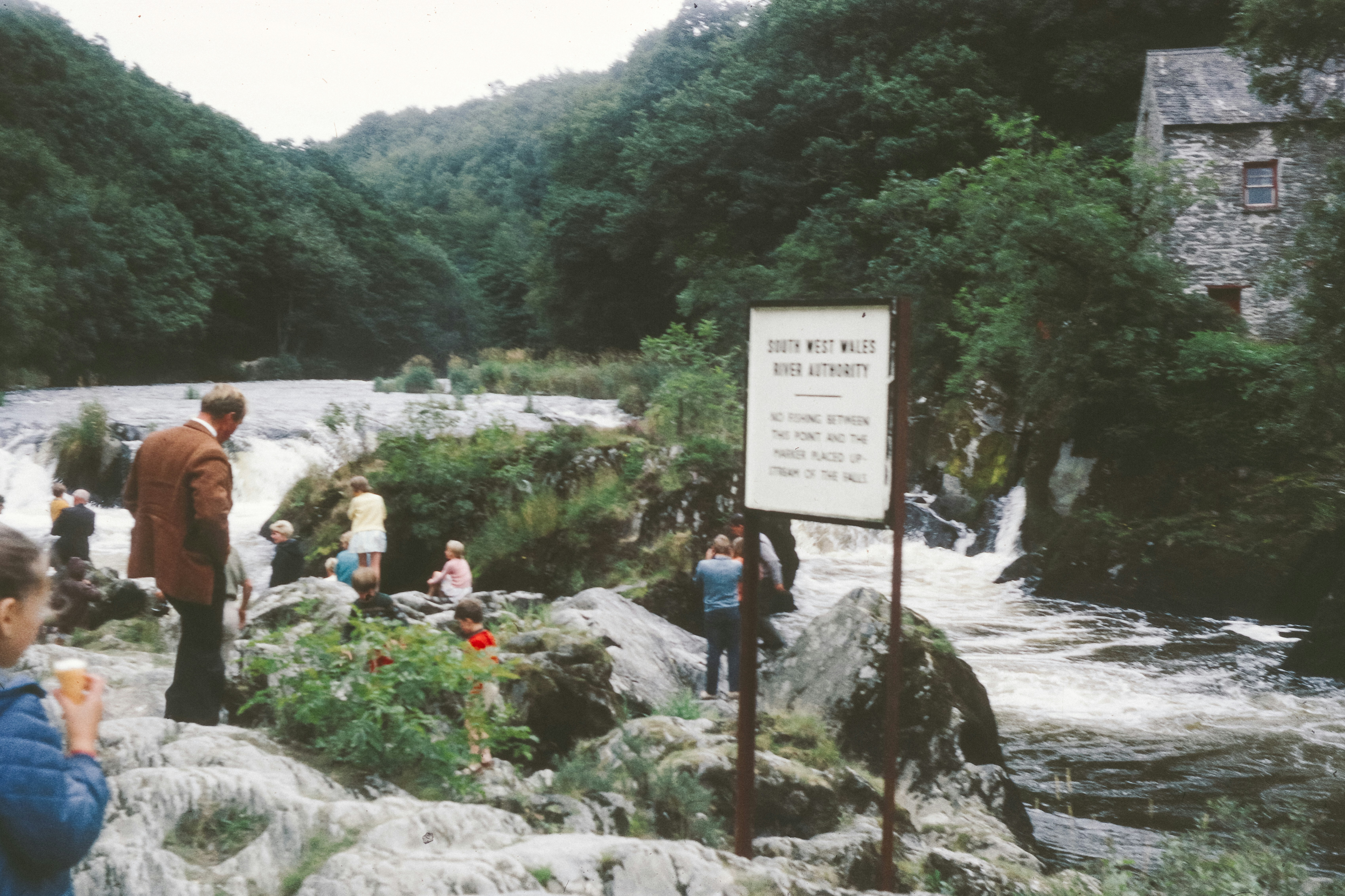 People by the Cascading River: A Slice of Riverside Scene