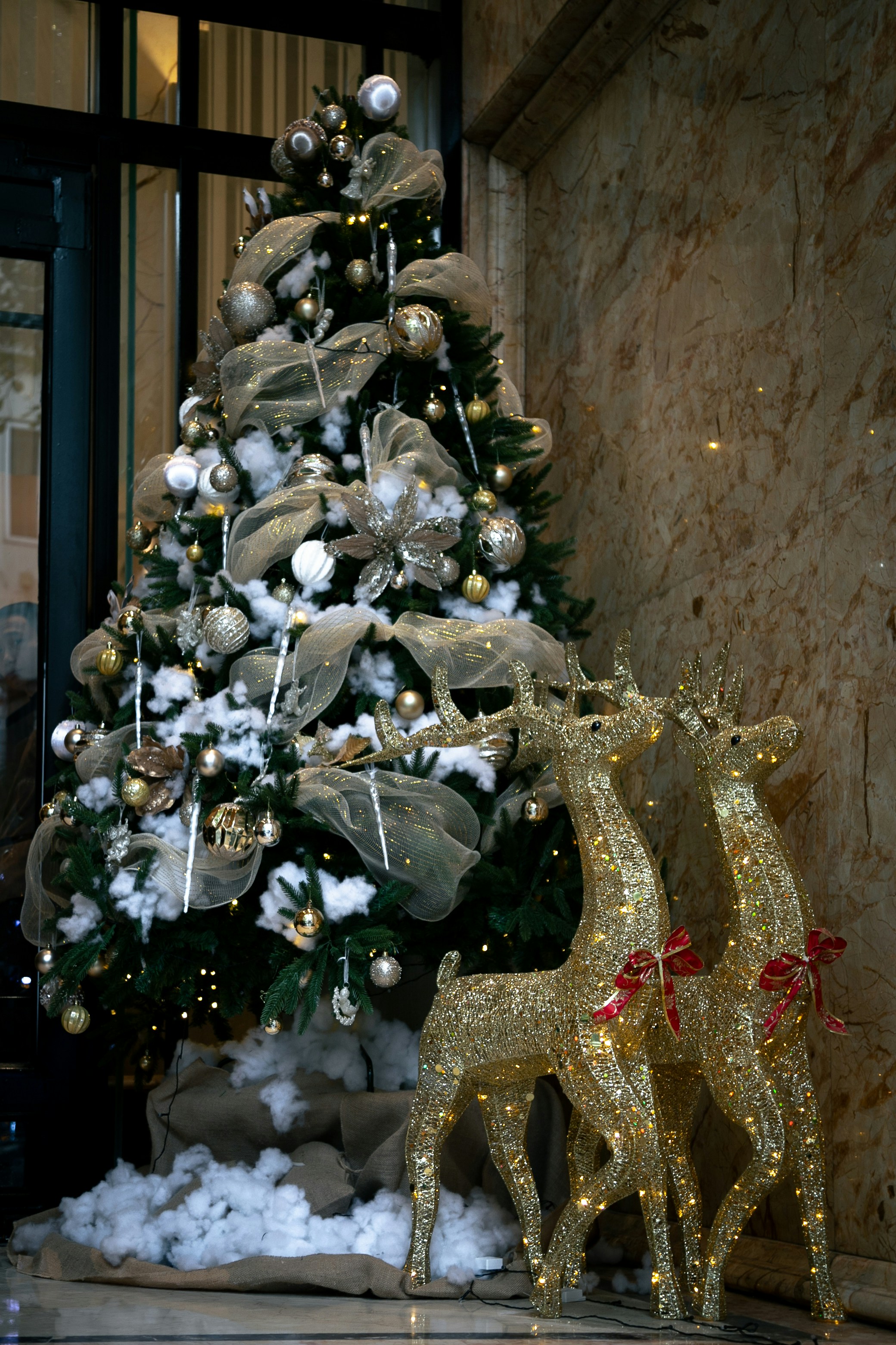 Glittering Reindeer Guarding the Orbed Christmas Tree