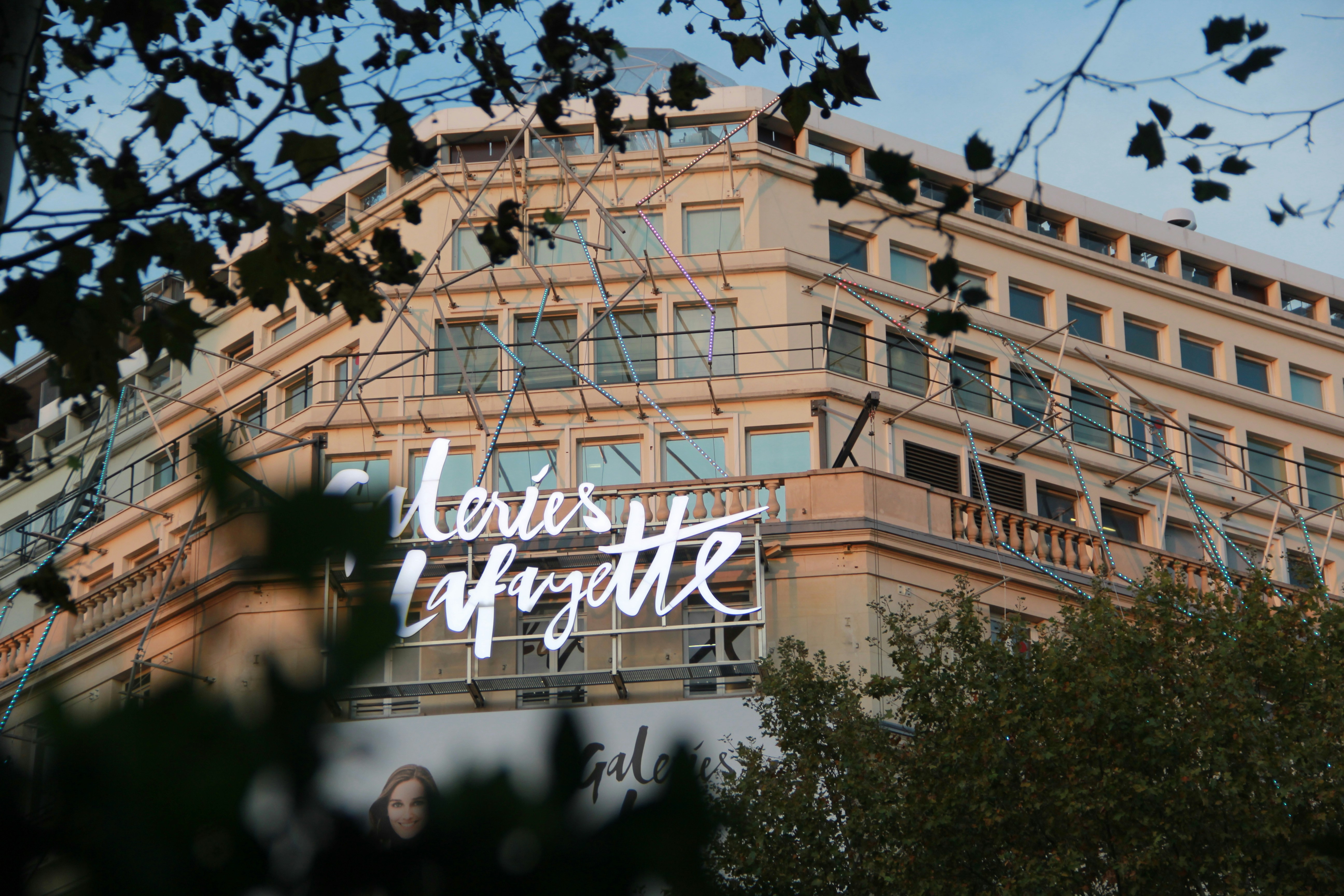 Galeries lafayette building facade with trees photo – Free Architecture ...