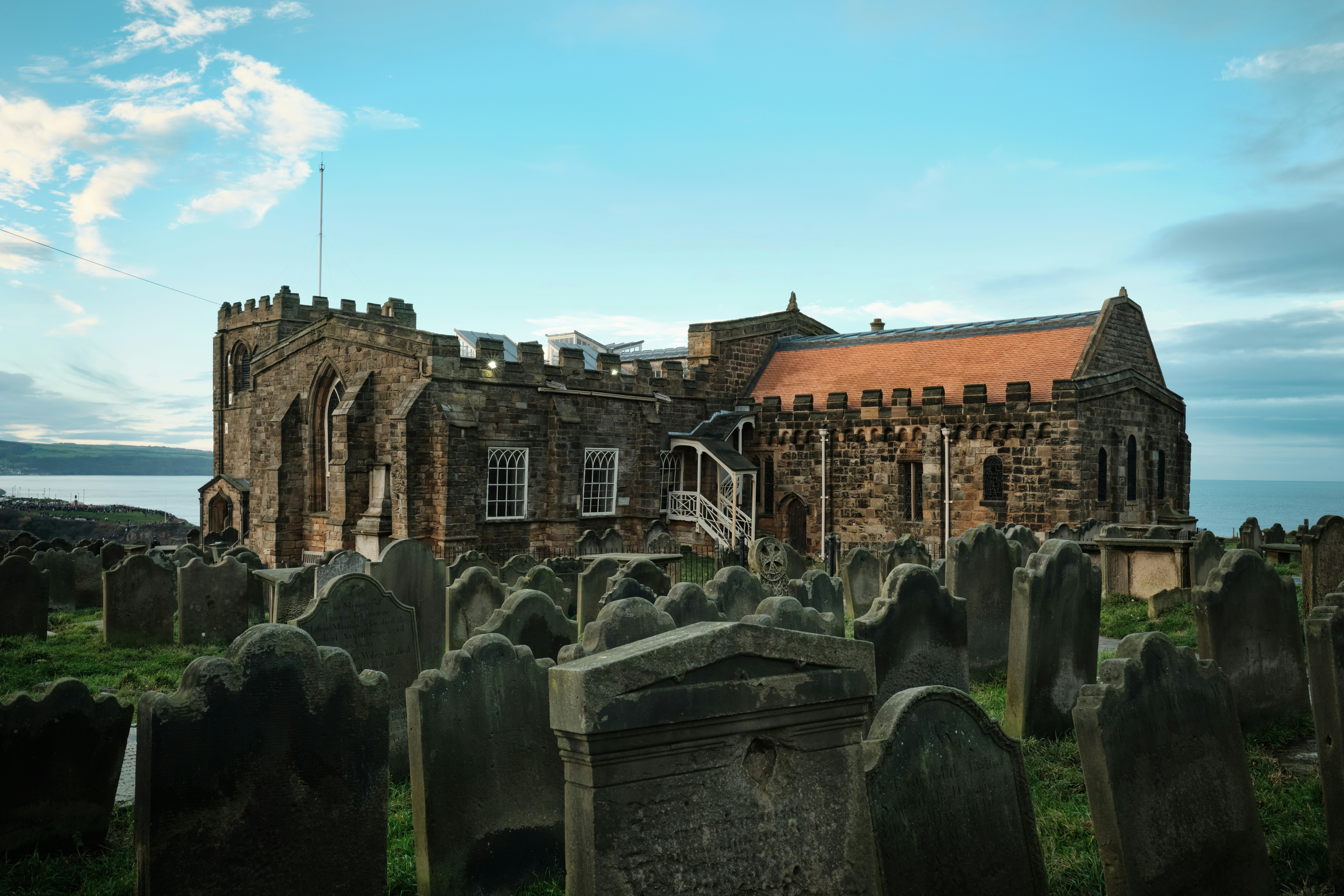 St. Mary's church sits on top of Whitby's east cliff, overlooking the historic harbour. This photo is taken from the rear of the church building, overlooking some of the graveyard.
