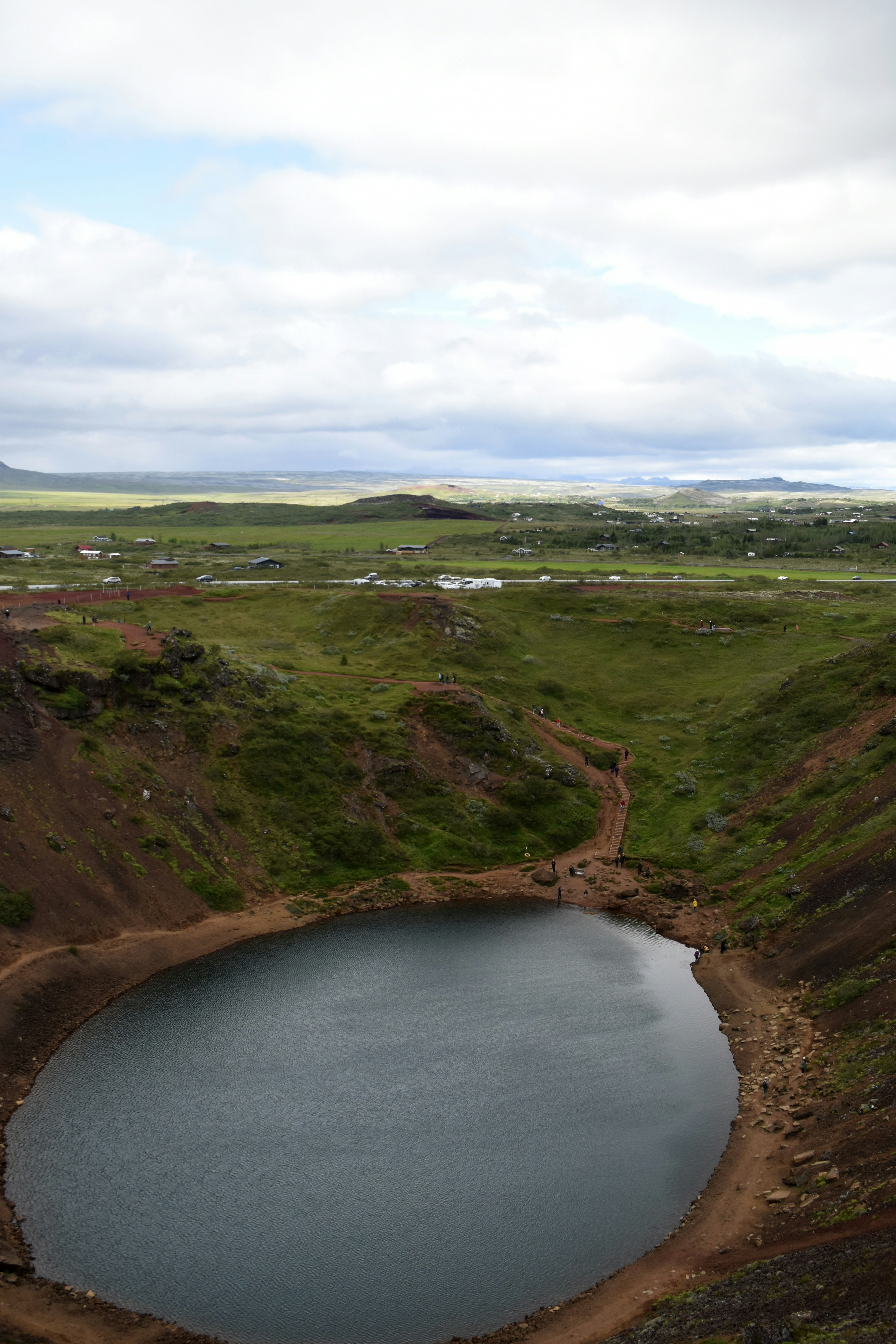 Crater Lake Quiet: A Circular Basin Carved into Green Hills
