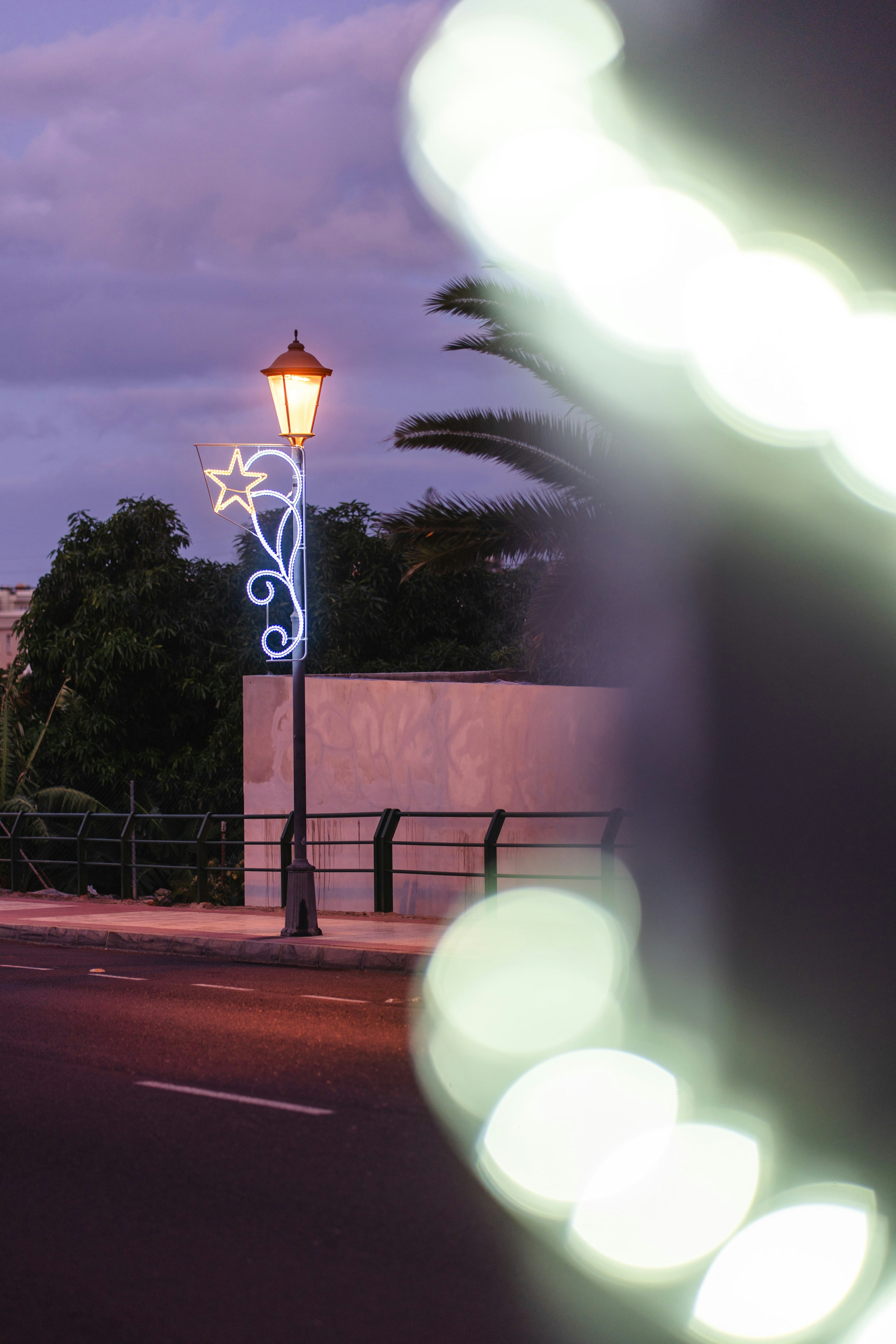 Night Street Lanterns: Neon Star Refracted Through Soft Bokeh