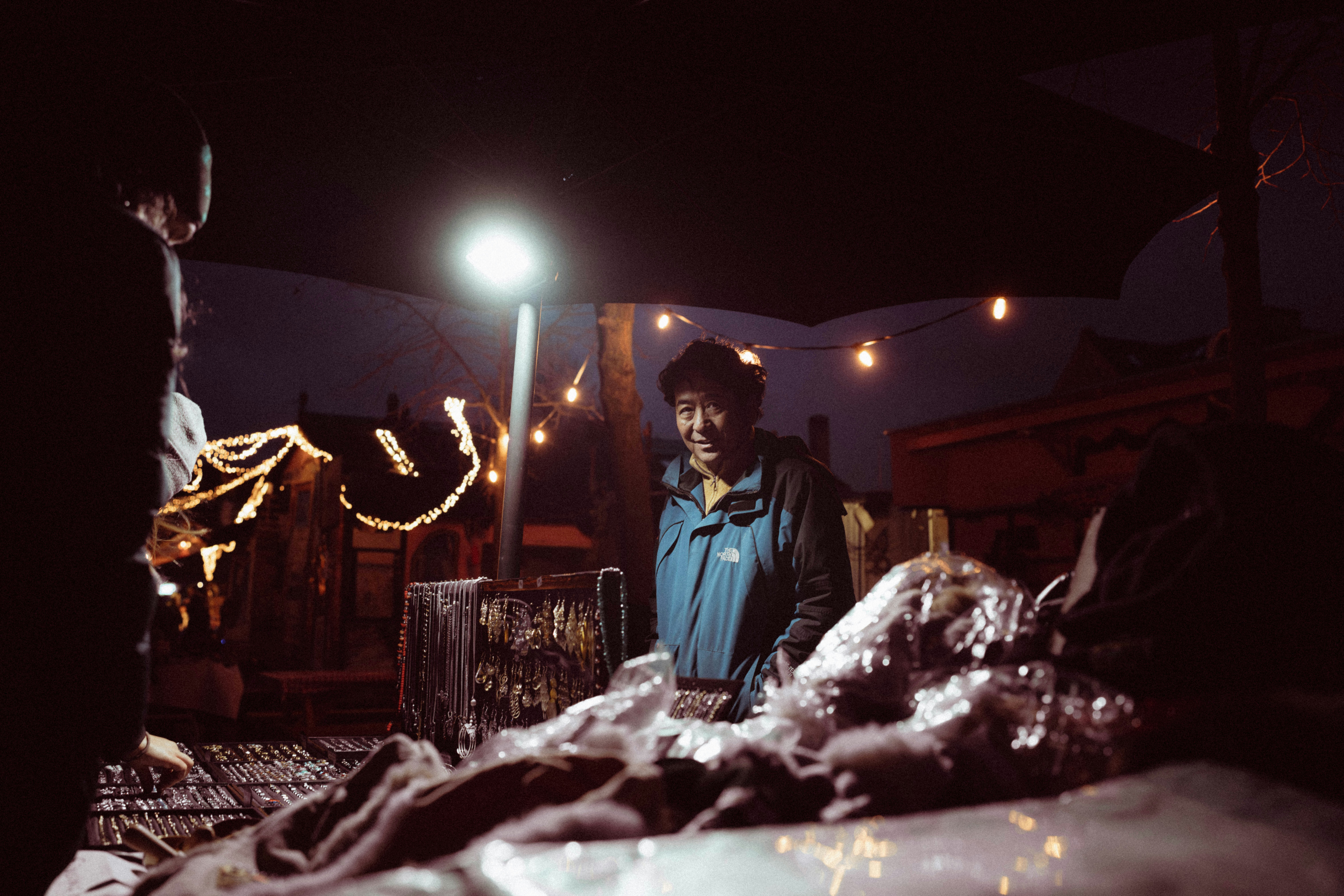 Night Market Encounter: A Vendor under Warm Light