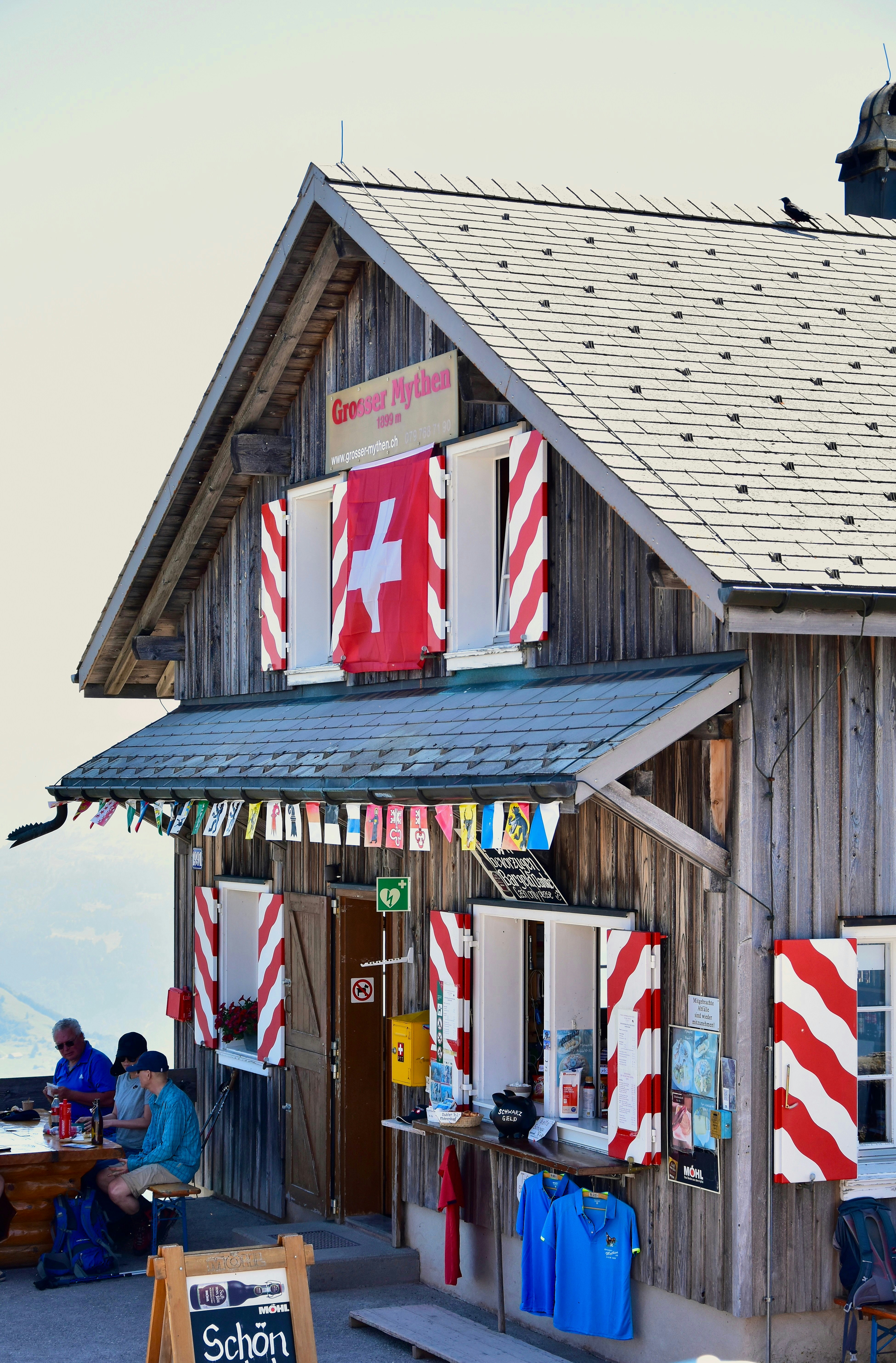 Swiss Chalet at Altitude: Flags, Stripes and a Mountain Outpost
