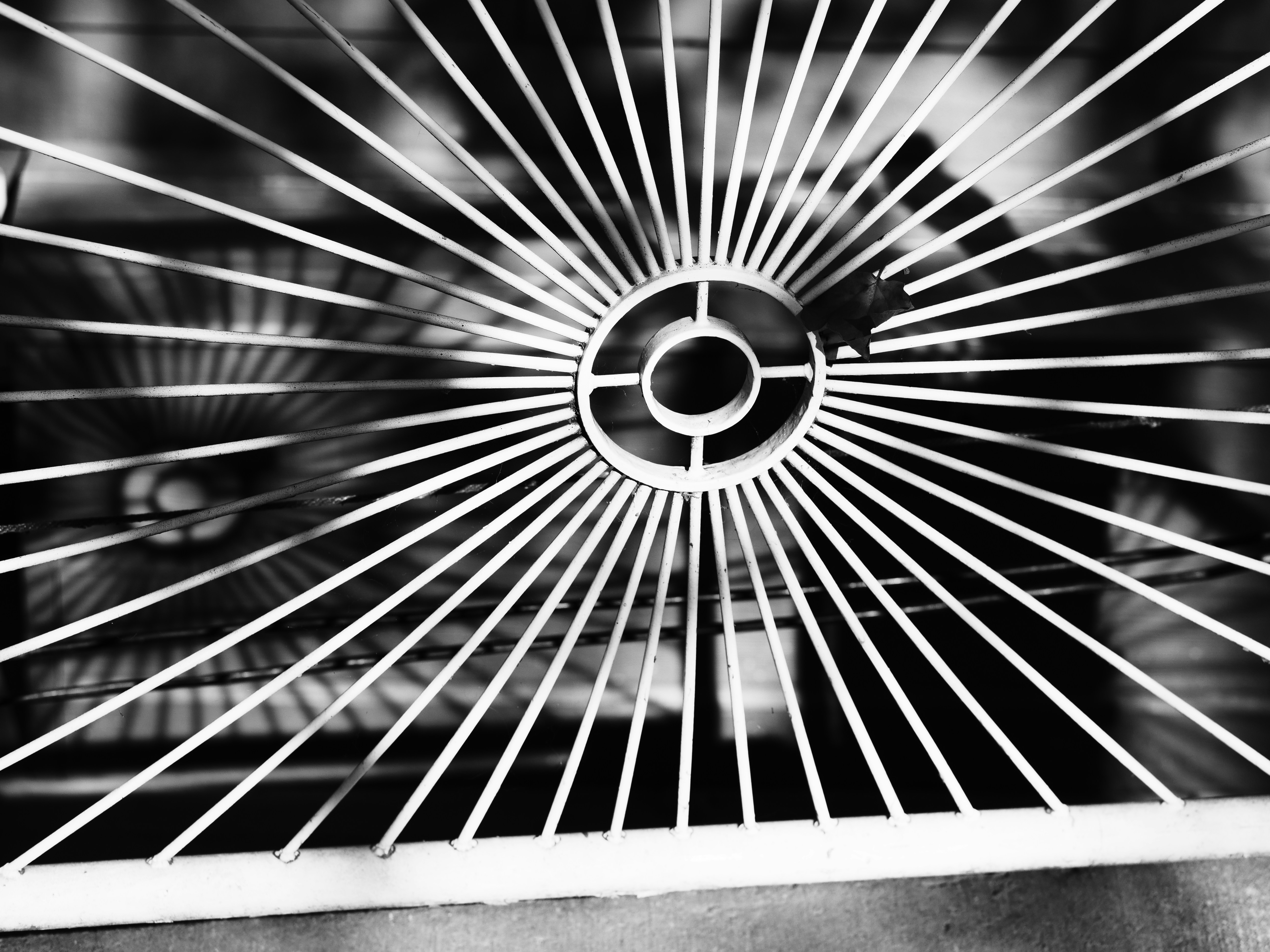 Radiating Grille: A Closeup of a Sunburst Drain Guard