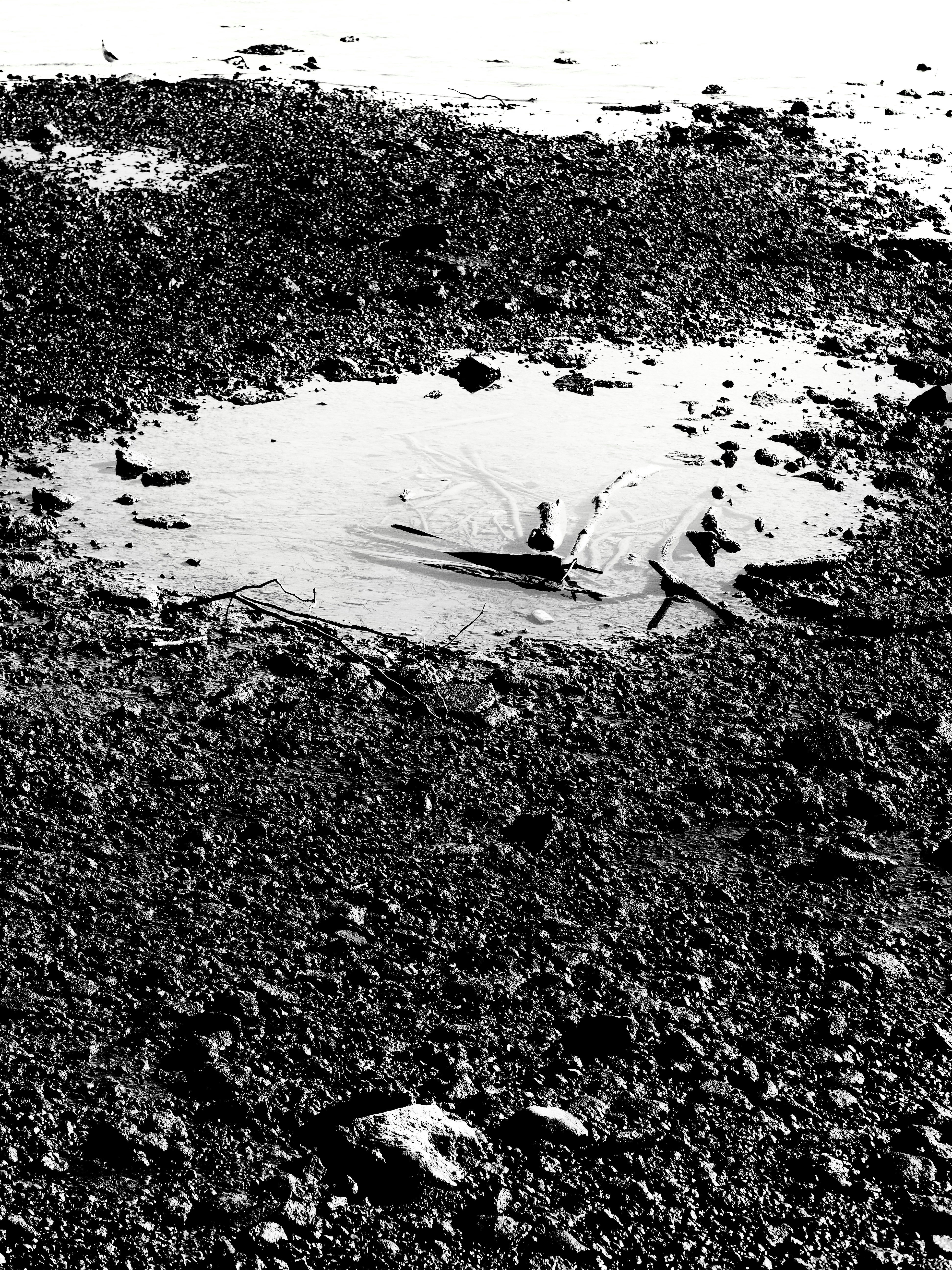 Spot in the Dust: a broken shard in a stark lunar-like crater