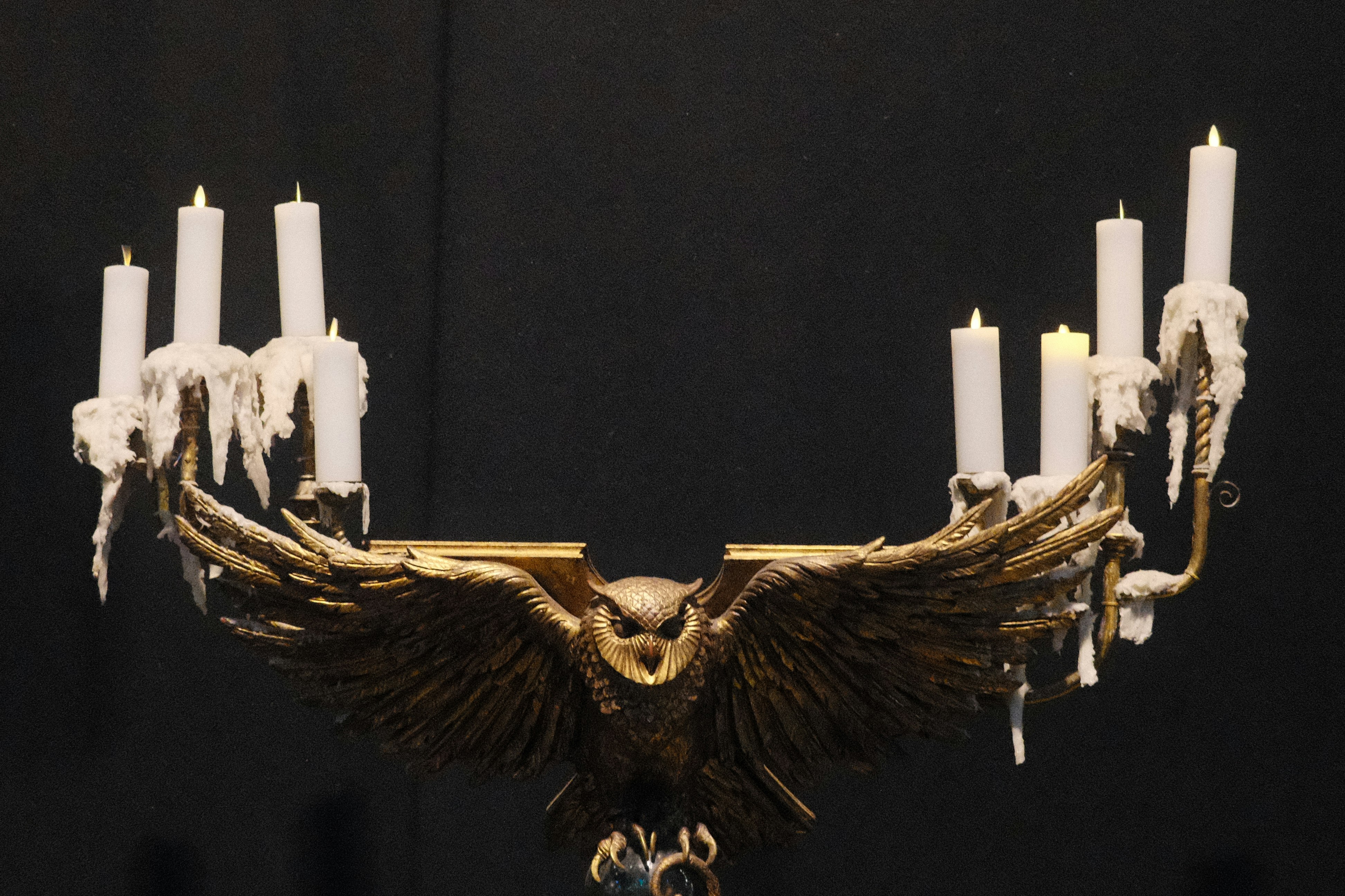 Candlelit Owl Crown: Asoaring Sculpture with Flaming Night