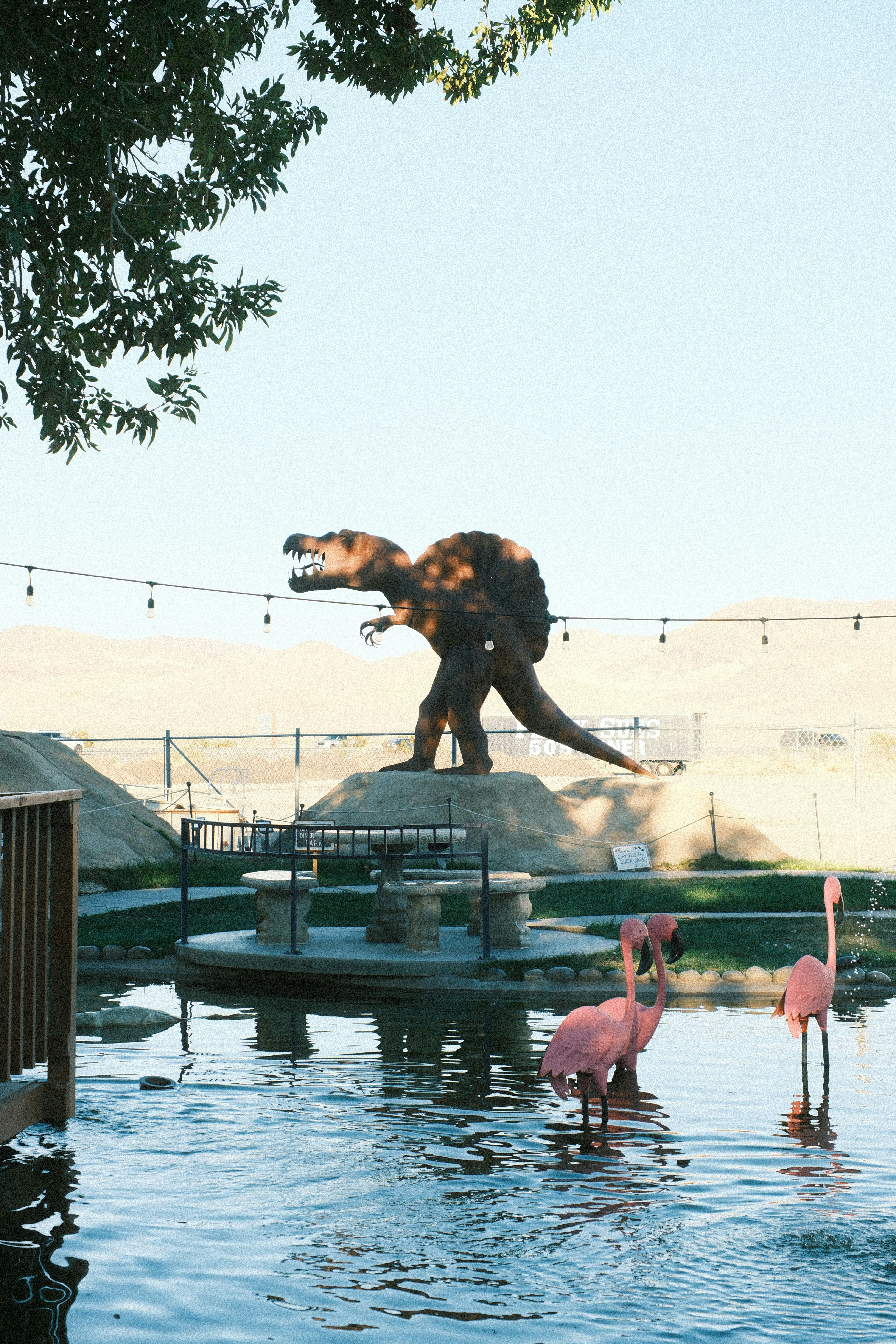 Dinosaur on the Dunes: A Statuesque Moment by the Water