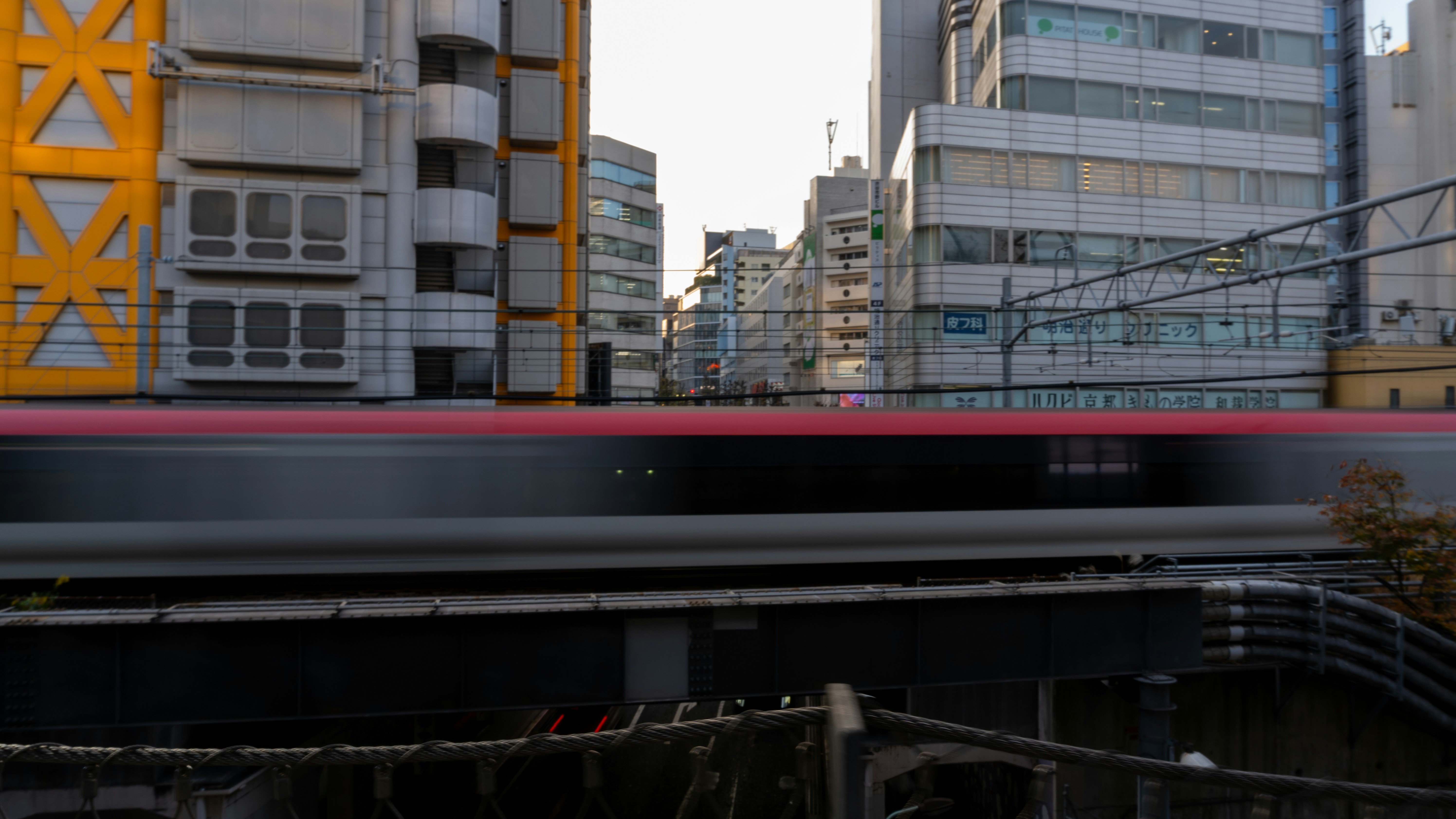 Transit Blur over a Shrouded Cityscape
