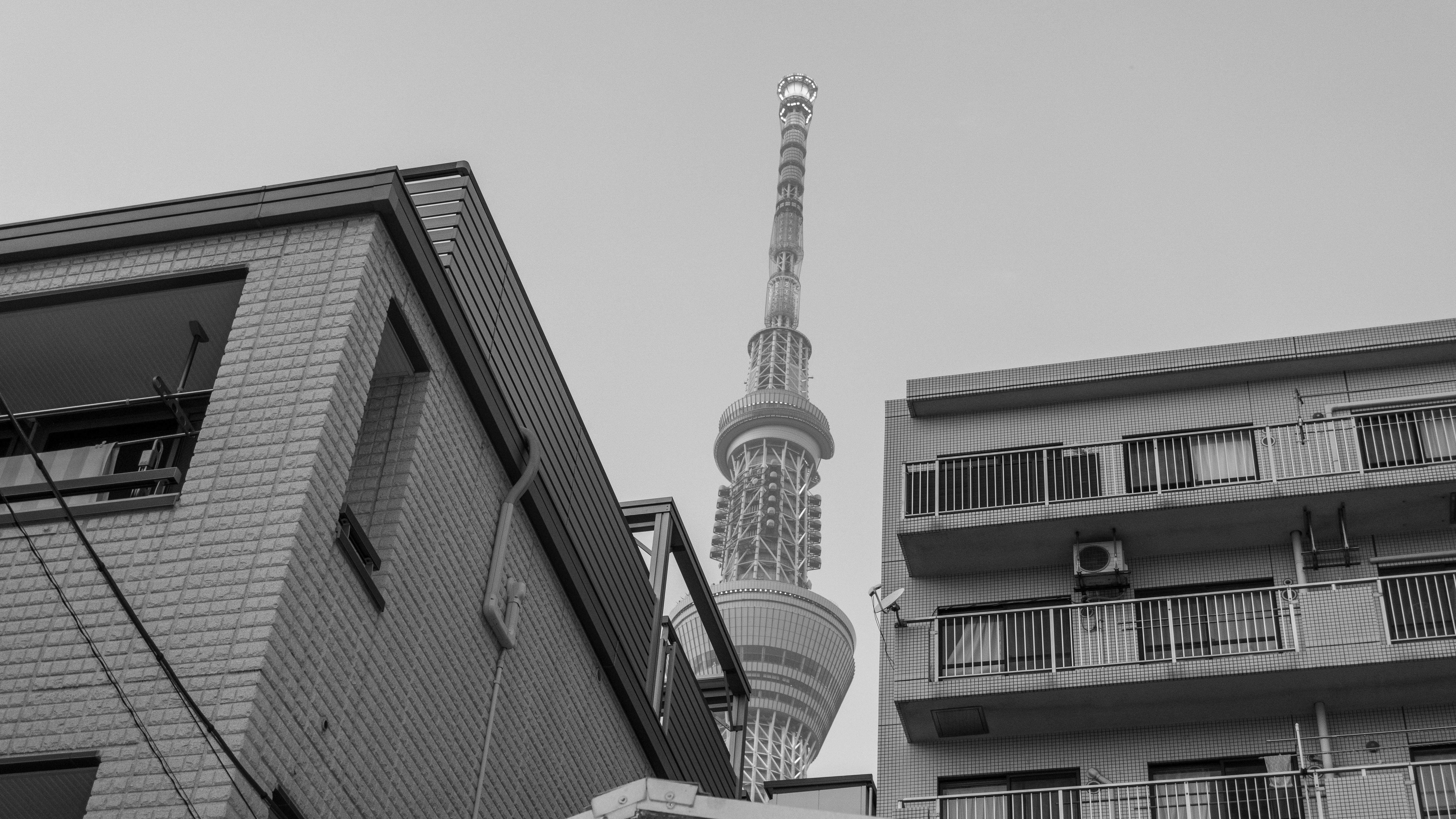 Towering Signal: Cityscape Meeting of Brick, Concrete, and Steel