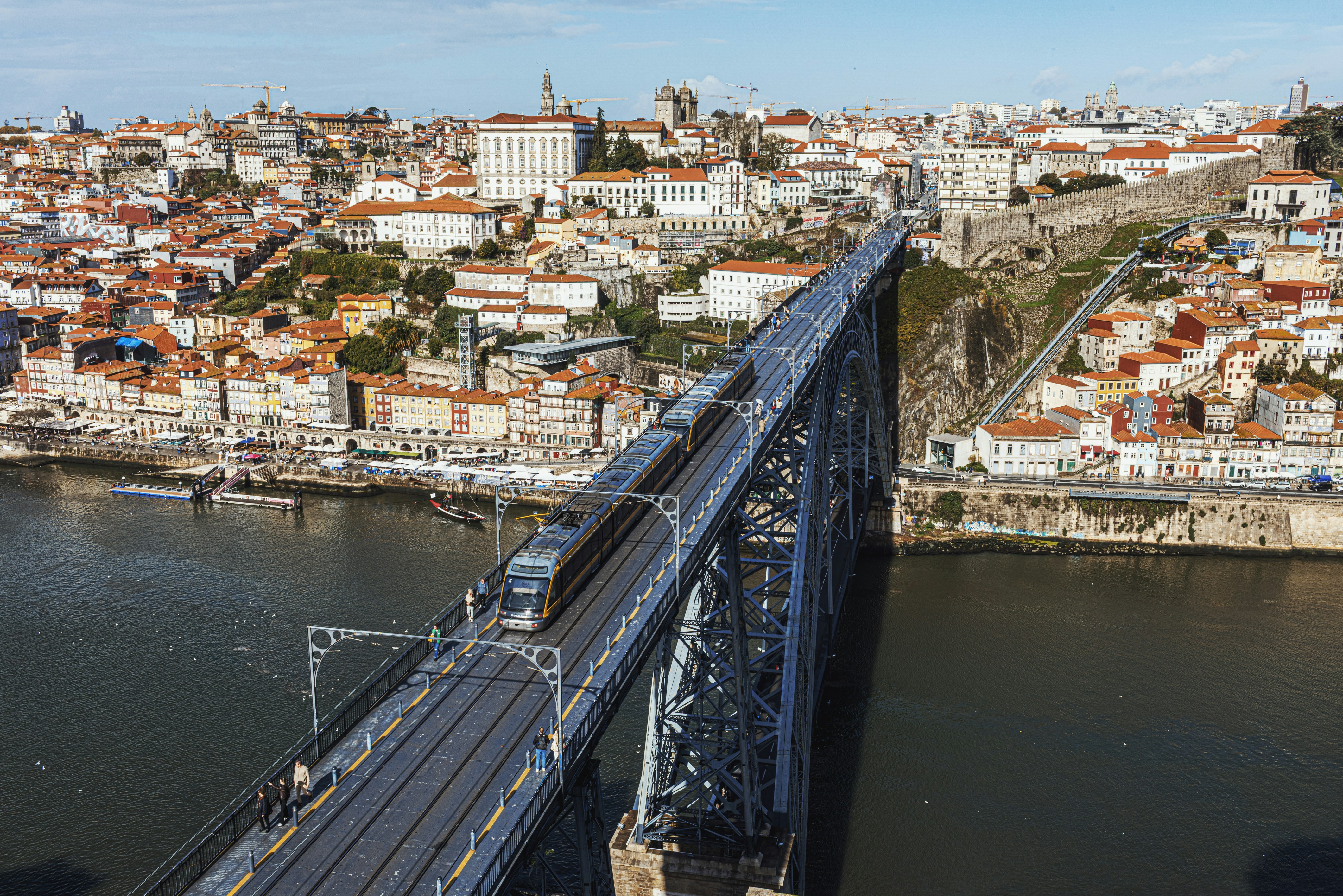 Blue Steel Artery: A Tranquil Train Crossing the Douro