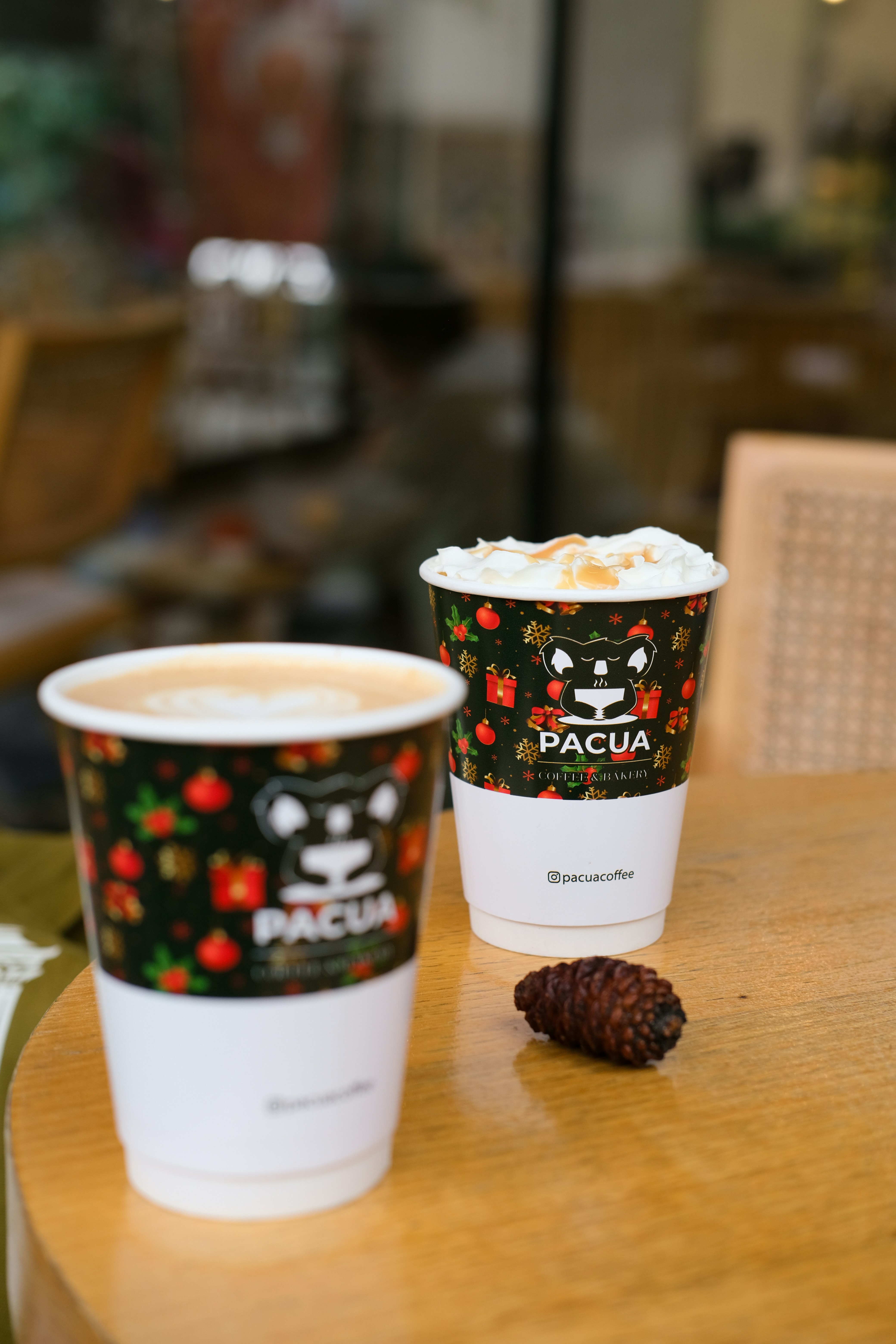 Steaming Unity: Two holiday cups at a wooden table