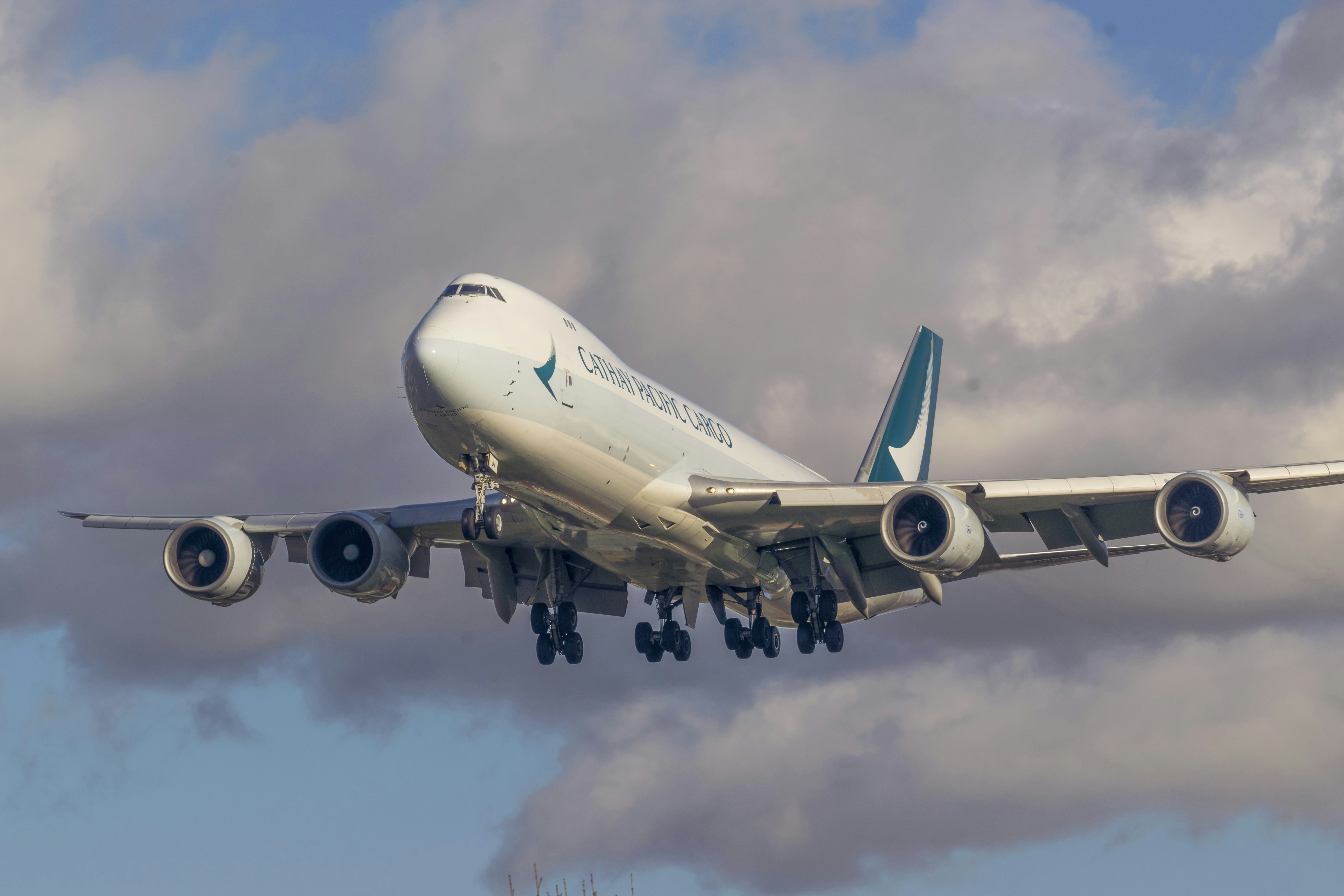 Winged Giant in the Sky: A Boeing 747 Rises Through Puffy Clouds