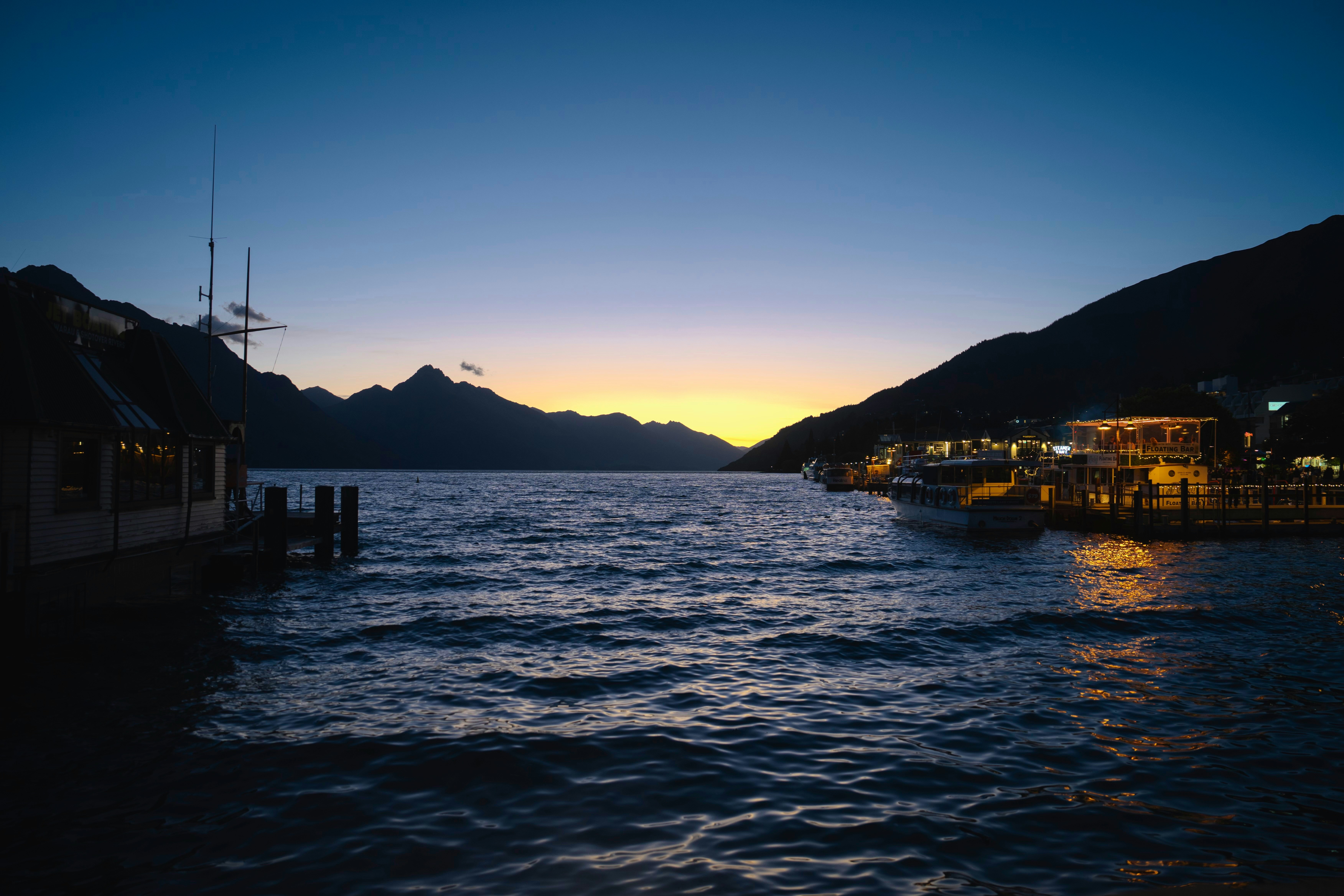 Dusk over the Fjord: Distant Mountains, Quiet Marina Lights