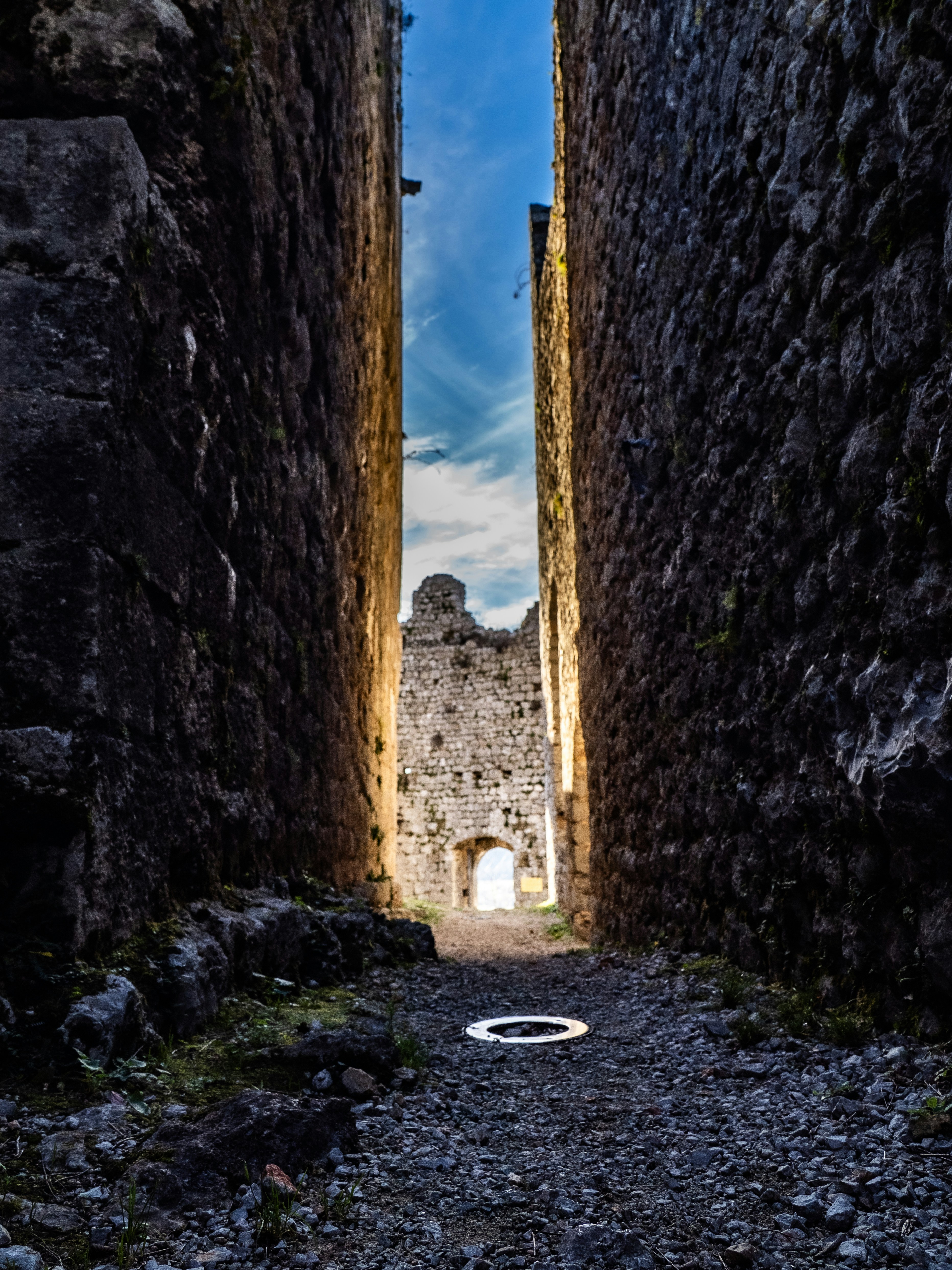 Through the Stone Slice: Light at the Gate of a Ruined Passage