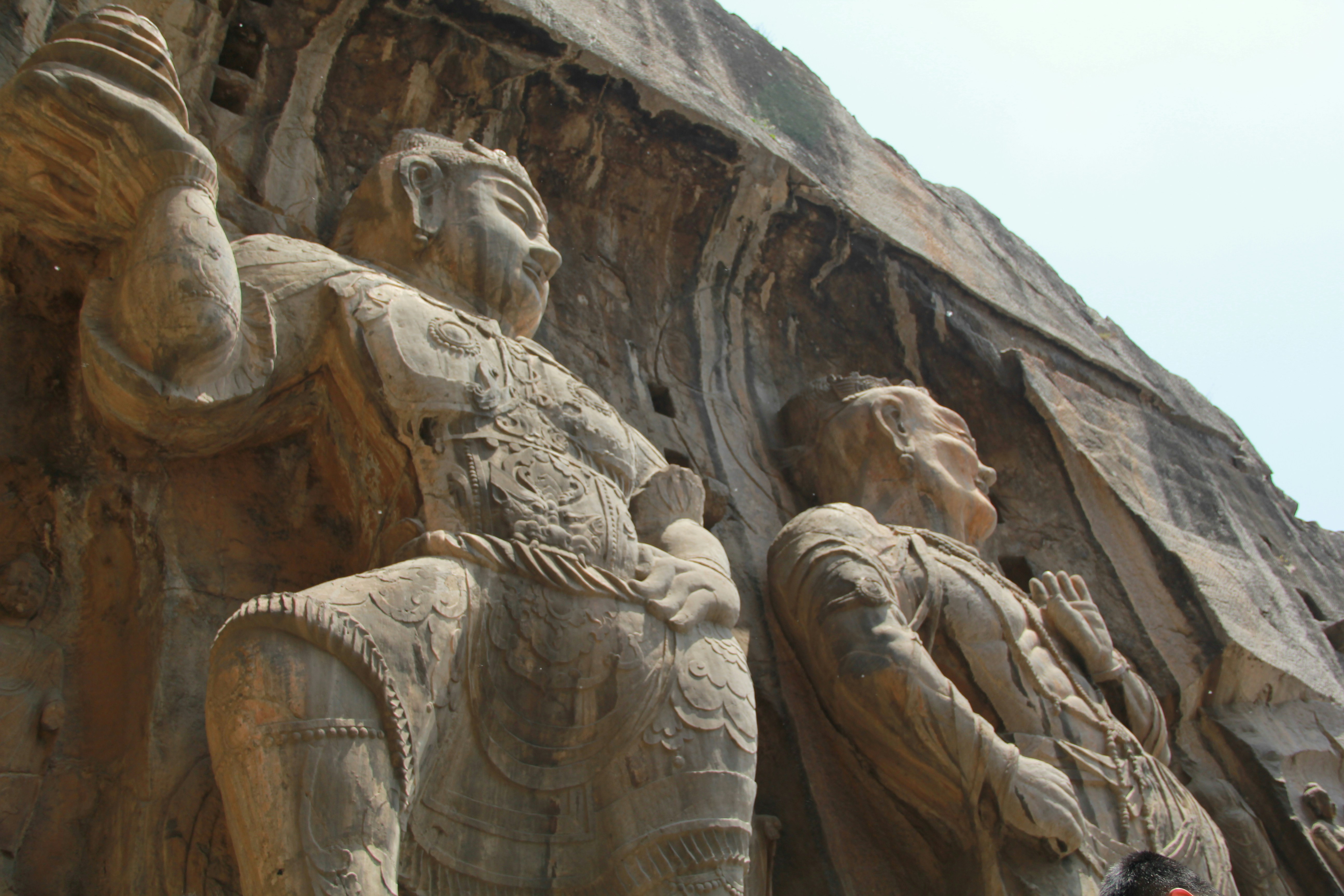 Stone Guardians: A Majestic Carved Pair Looms Over the viewer