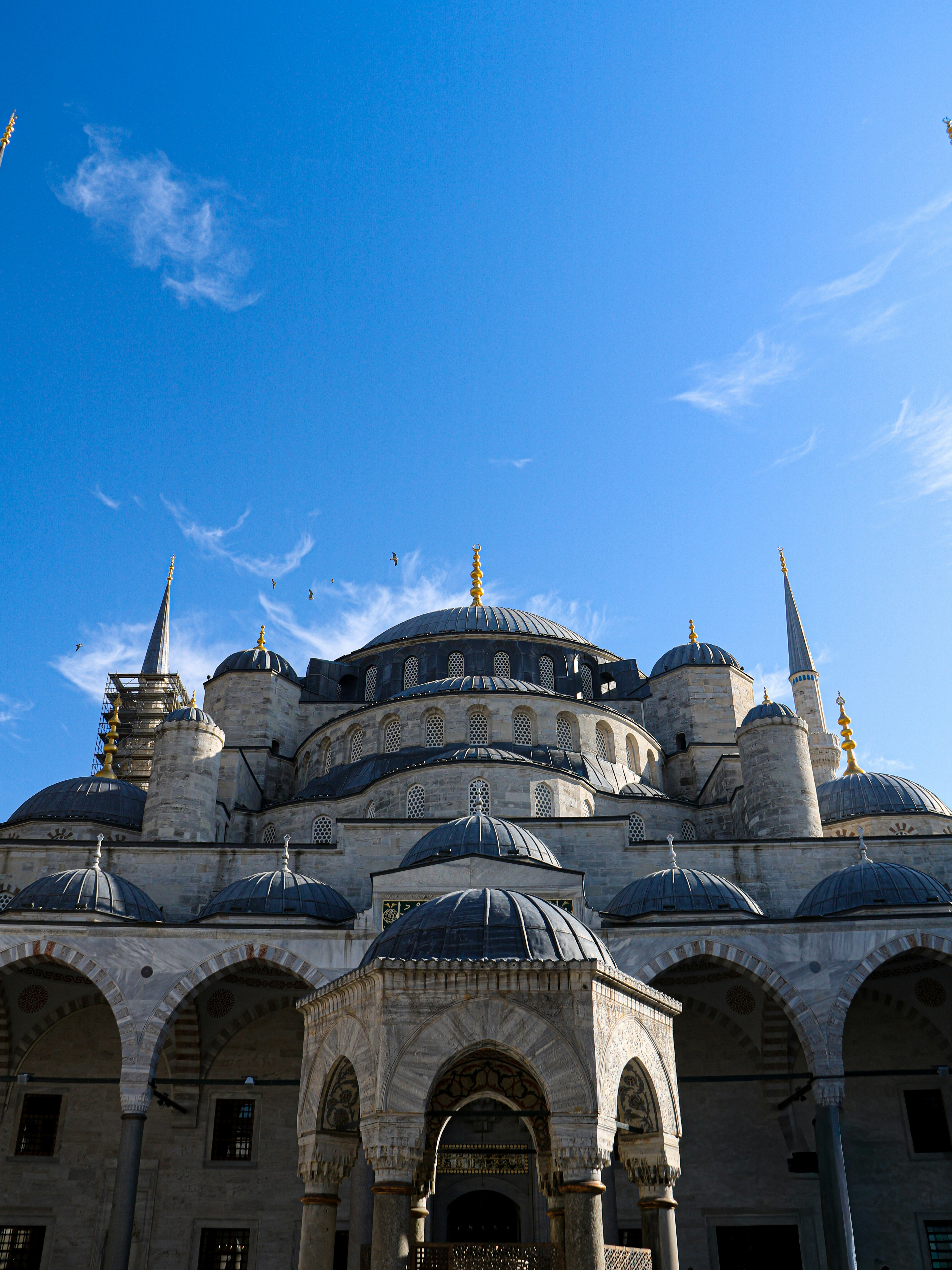 Majestic Ottoman Silhouette Under a Scaffolding of Blue Sky