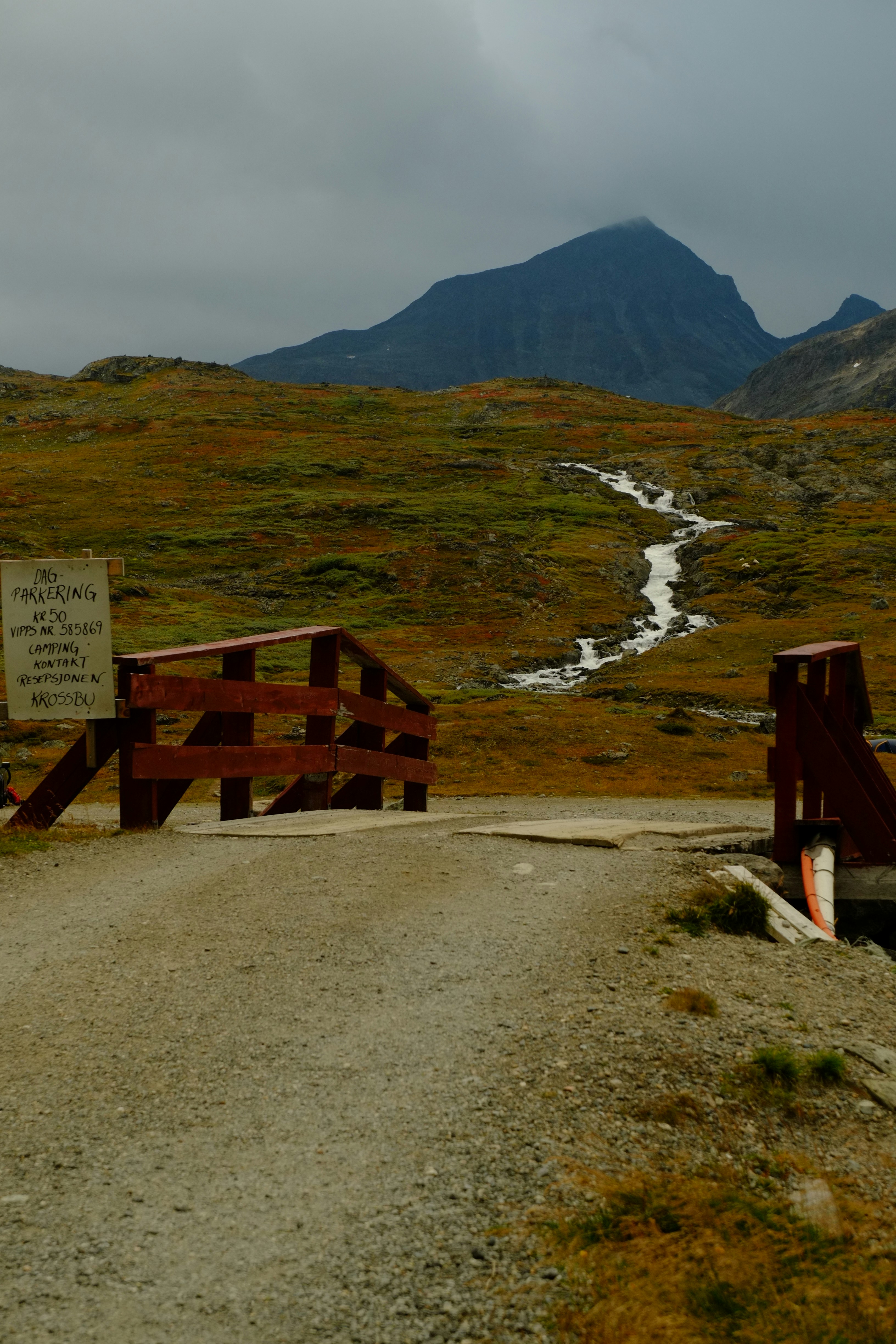 Trail to the Lone Peak: A Mountain Pass Under Dusky Skies