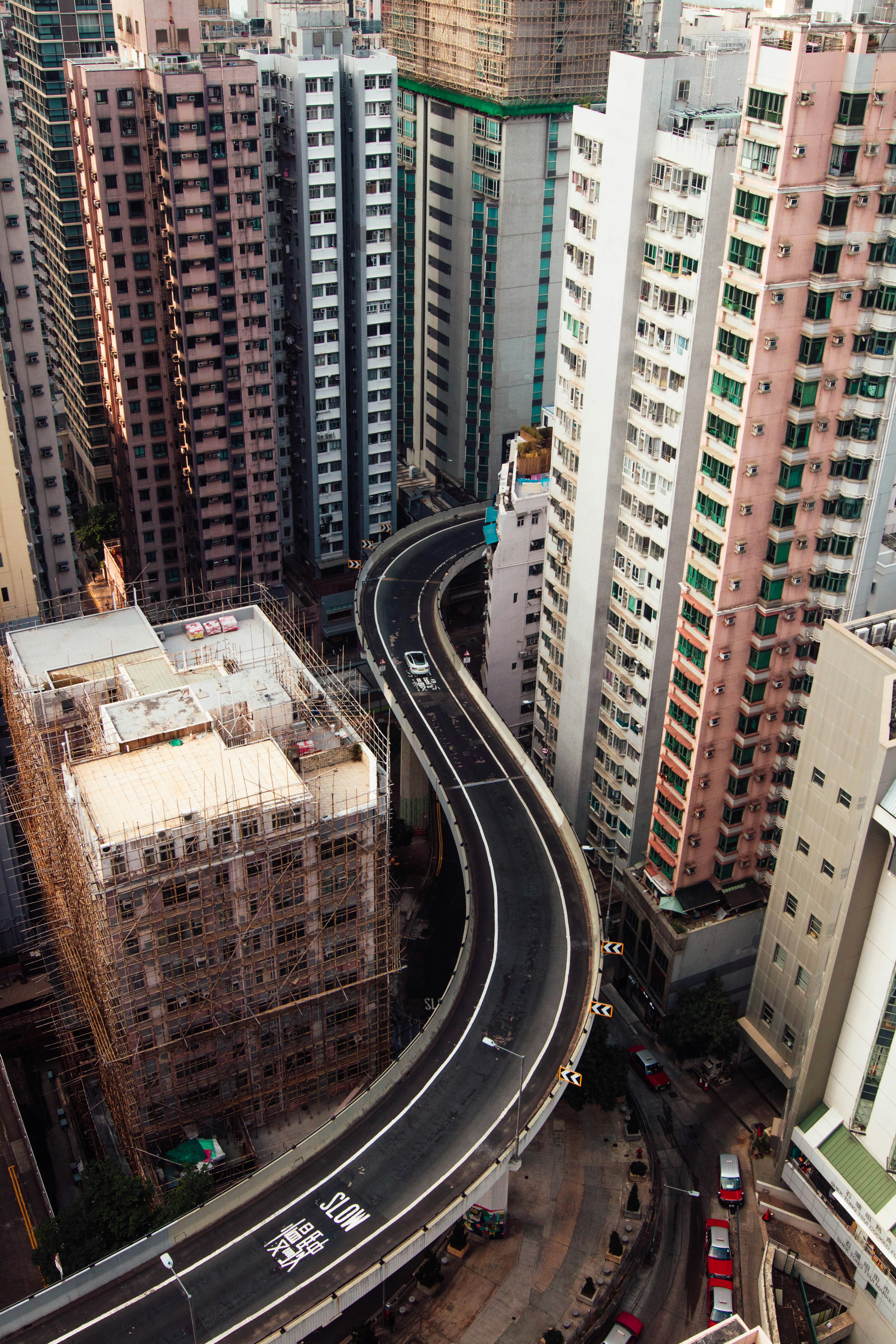 Elevated Highway Meanders Through Vertical Cityscape