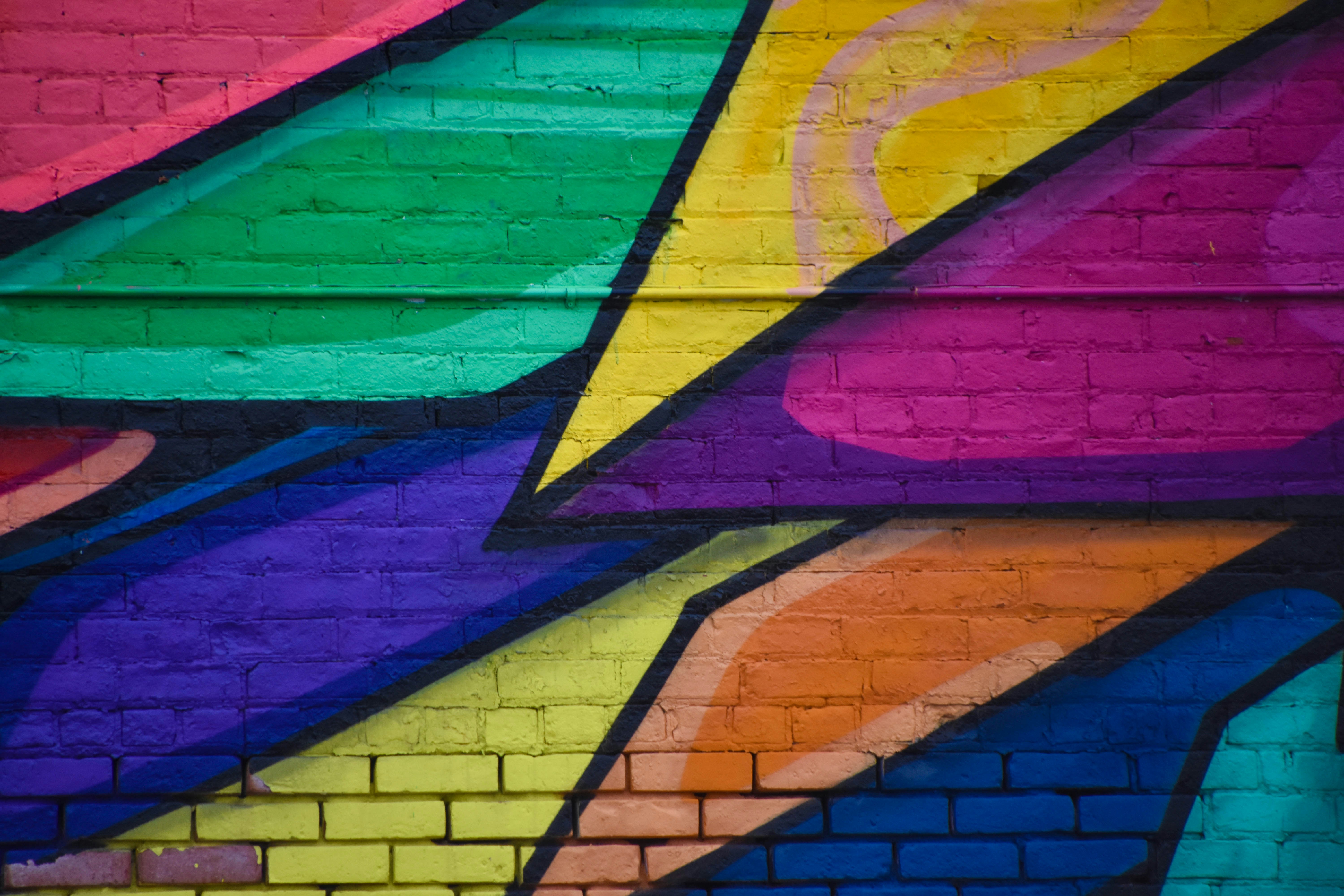 Colorful abstract graffiti art on brick wallThe Quiet Atlas