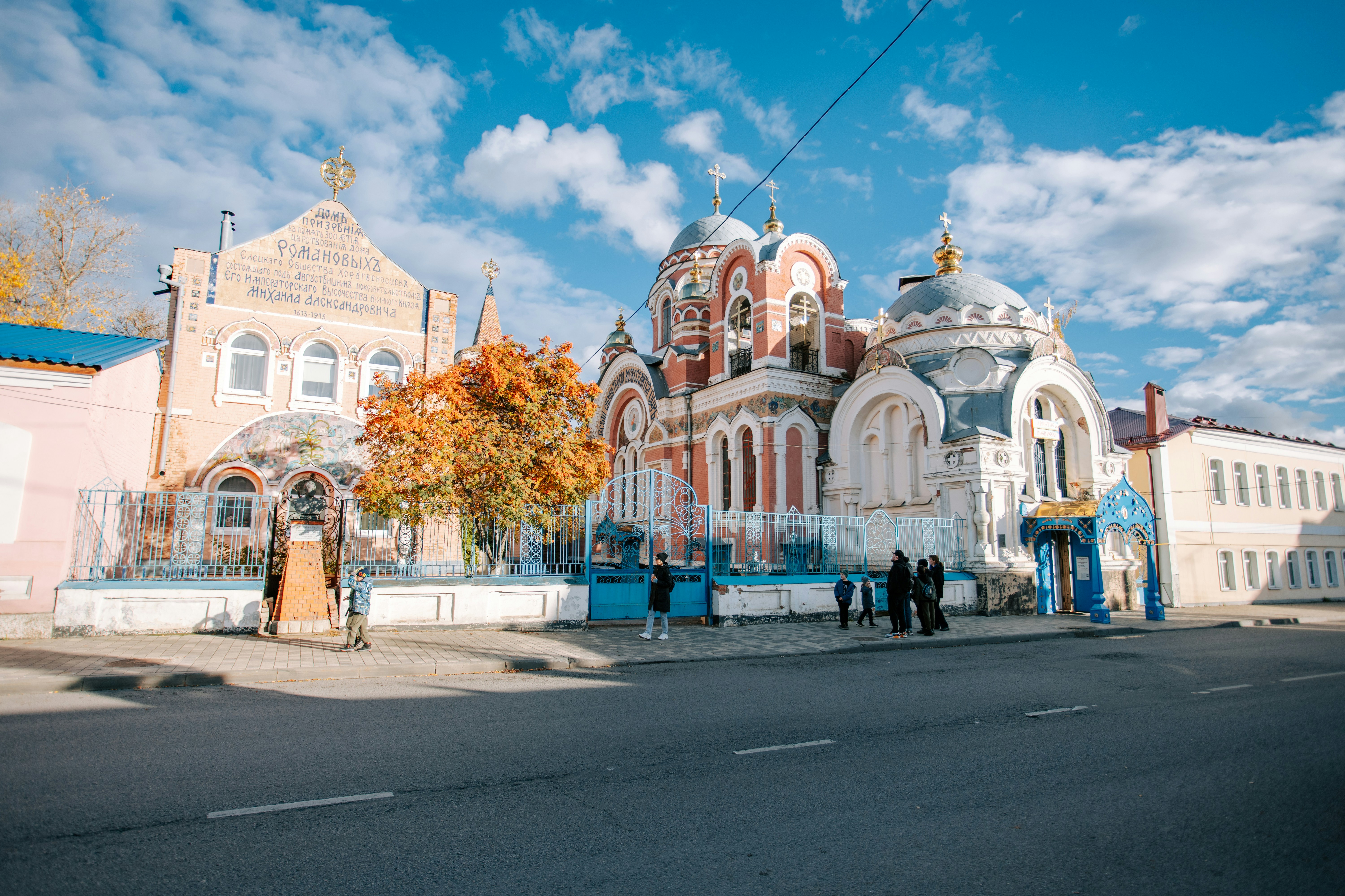 Ornate Orthodox Church Framed by Autumn Trees on a Quiet Street