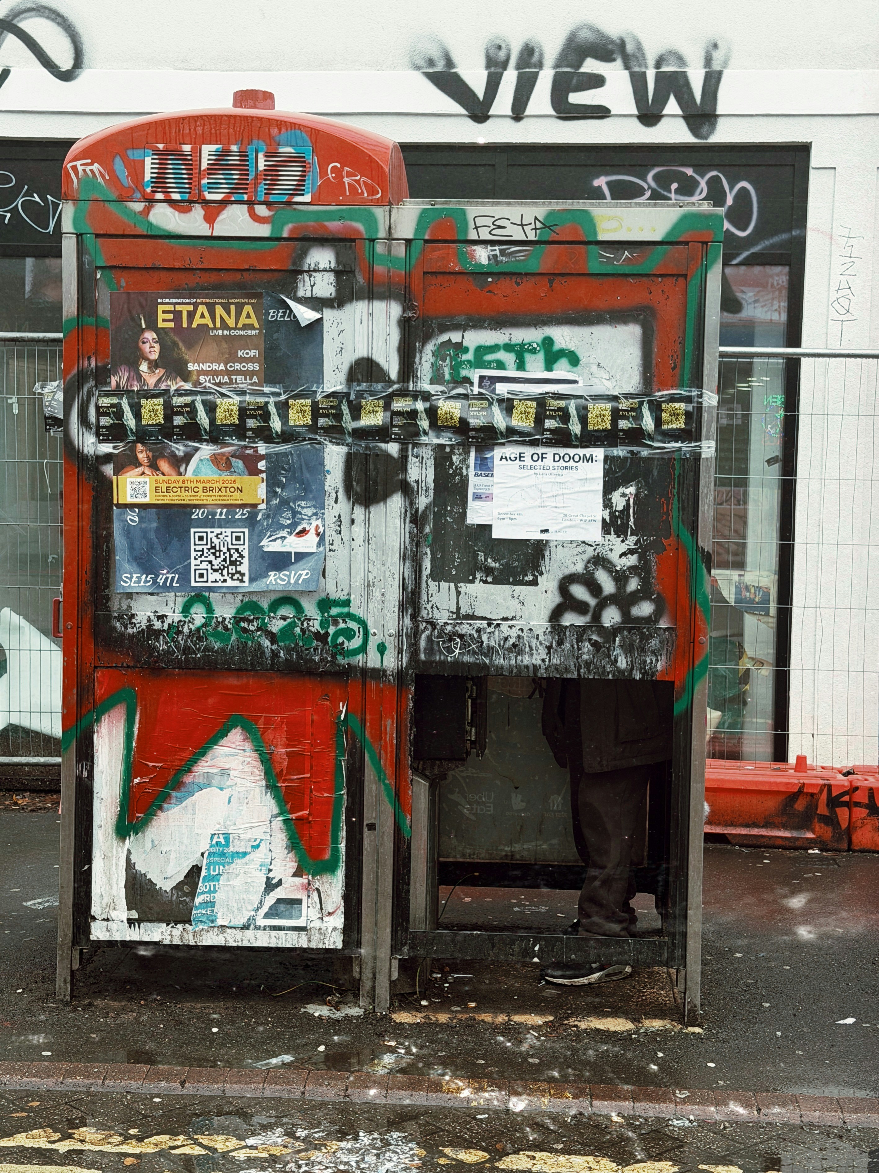 Graffitied Mailbox and Hidden Figure in the Alleyway