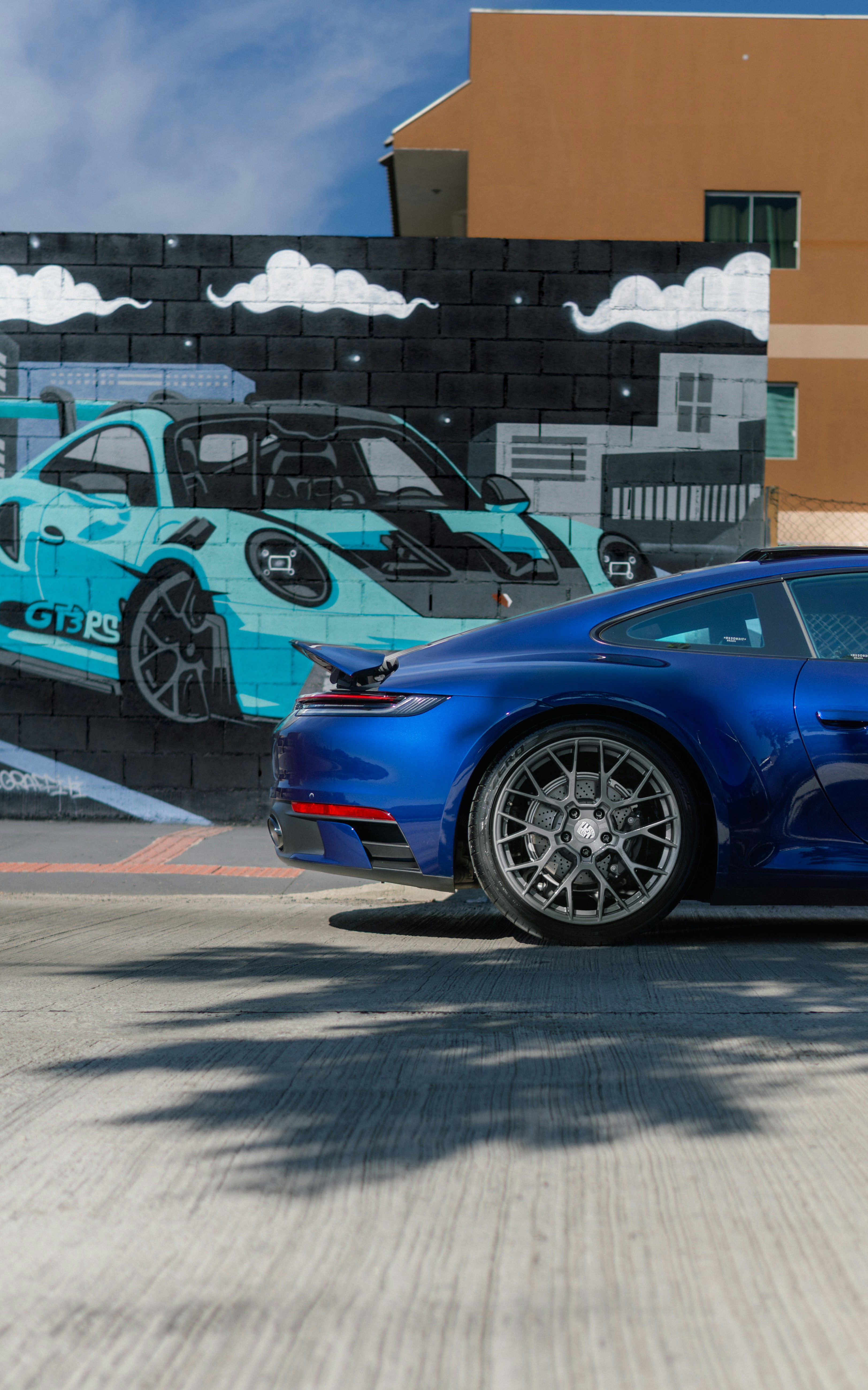 Blue Porsche at the Wall: Street Art and Power