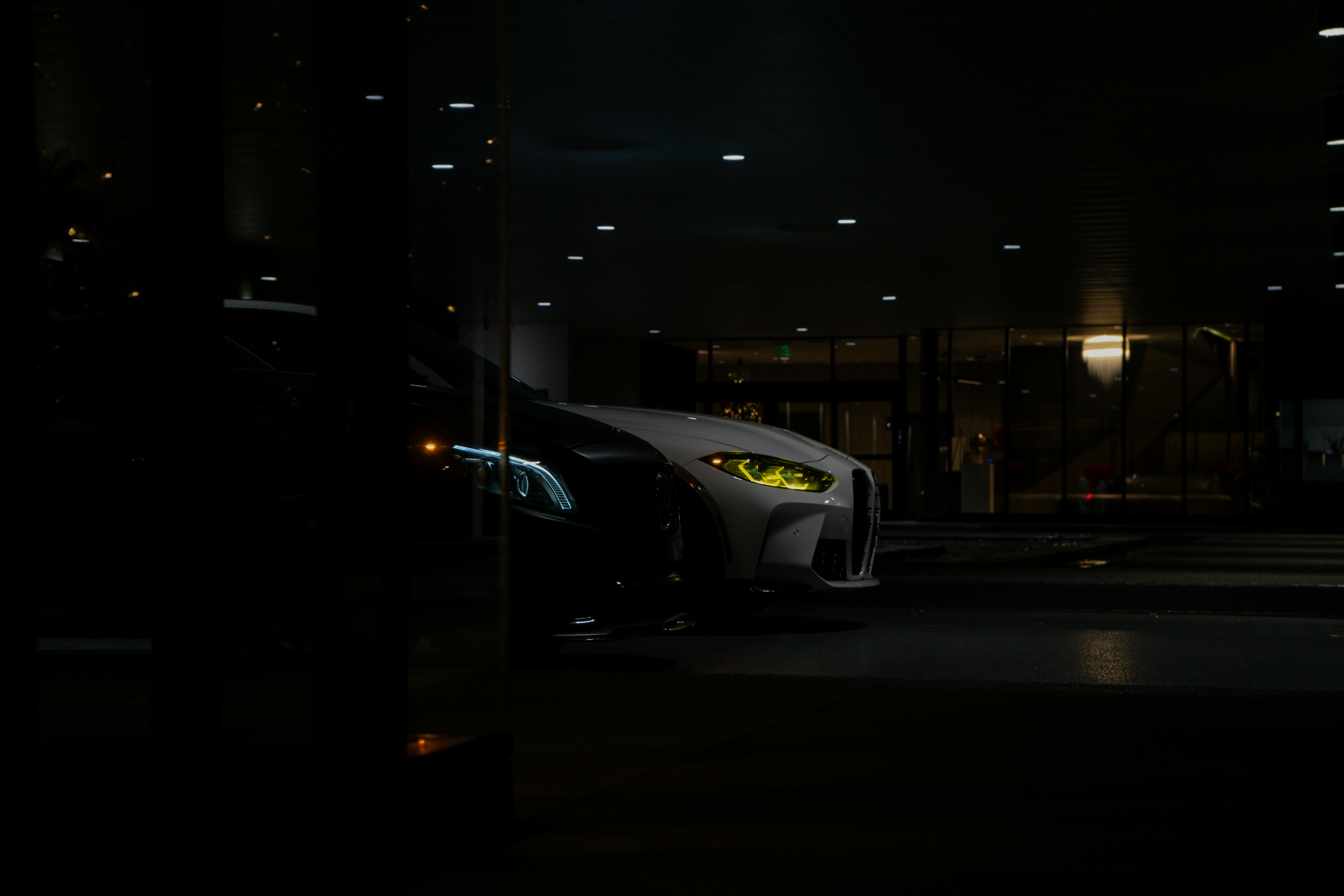 Low-Light Street Predator: A White Sports Car Emerges from the Shadows