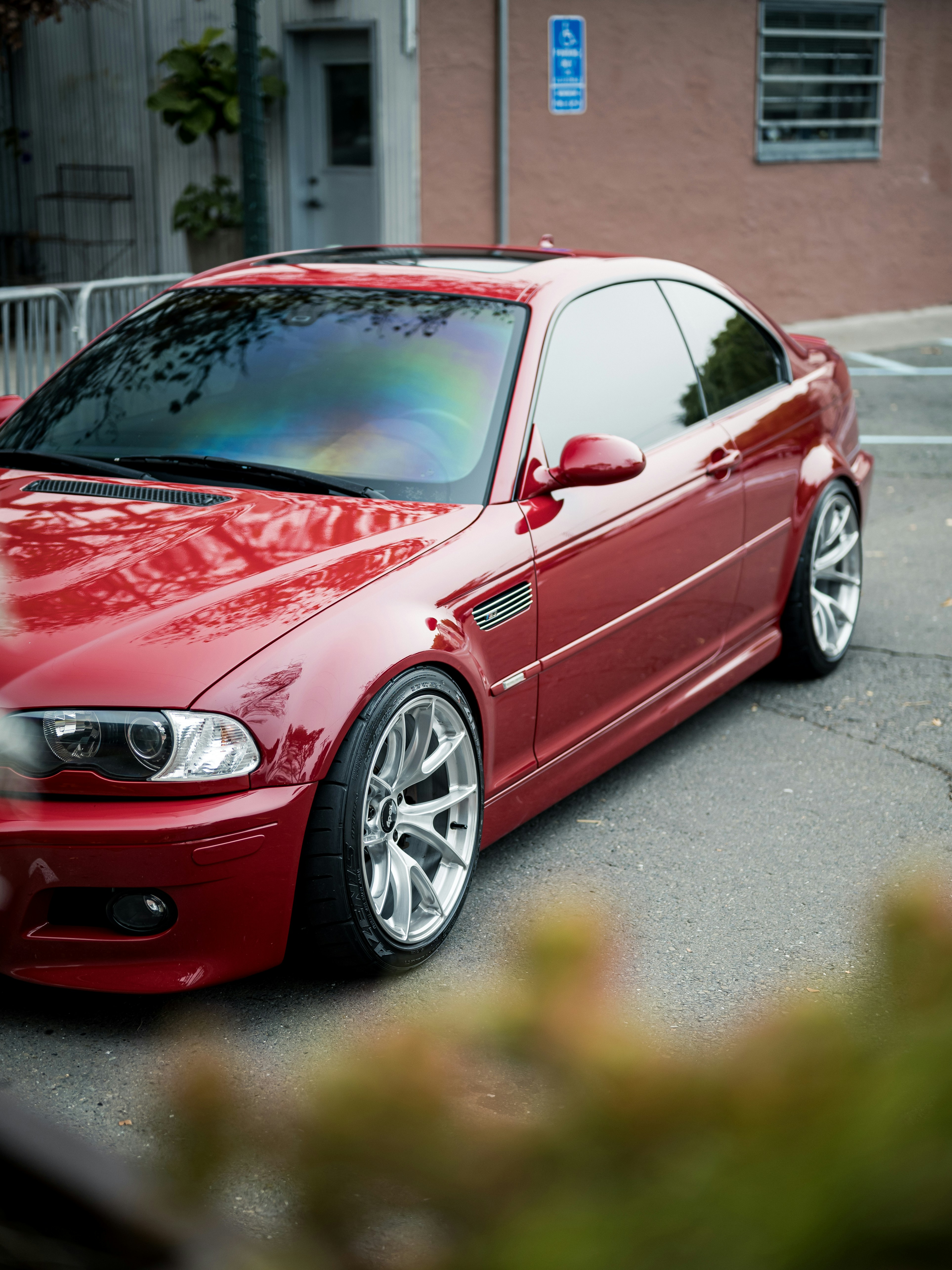 A Dinan modified Imola Red BMW E46 M3 photographed at Cars and Coffee Berkeley.