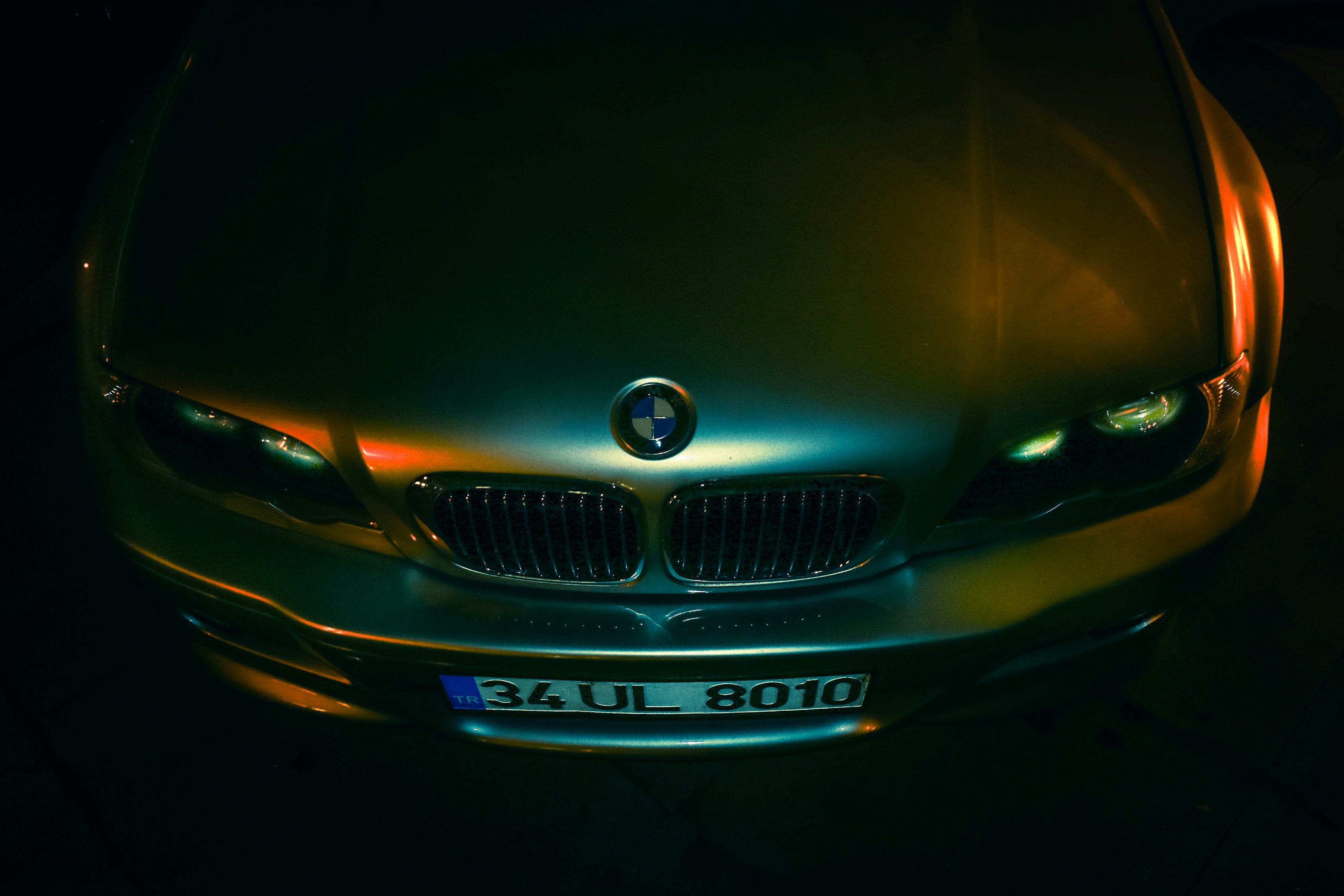 Low-Light Grille: Neon Highlights on a Dark BMW