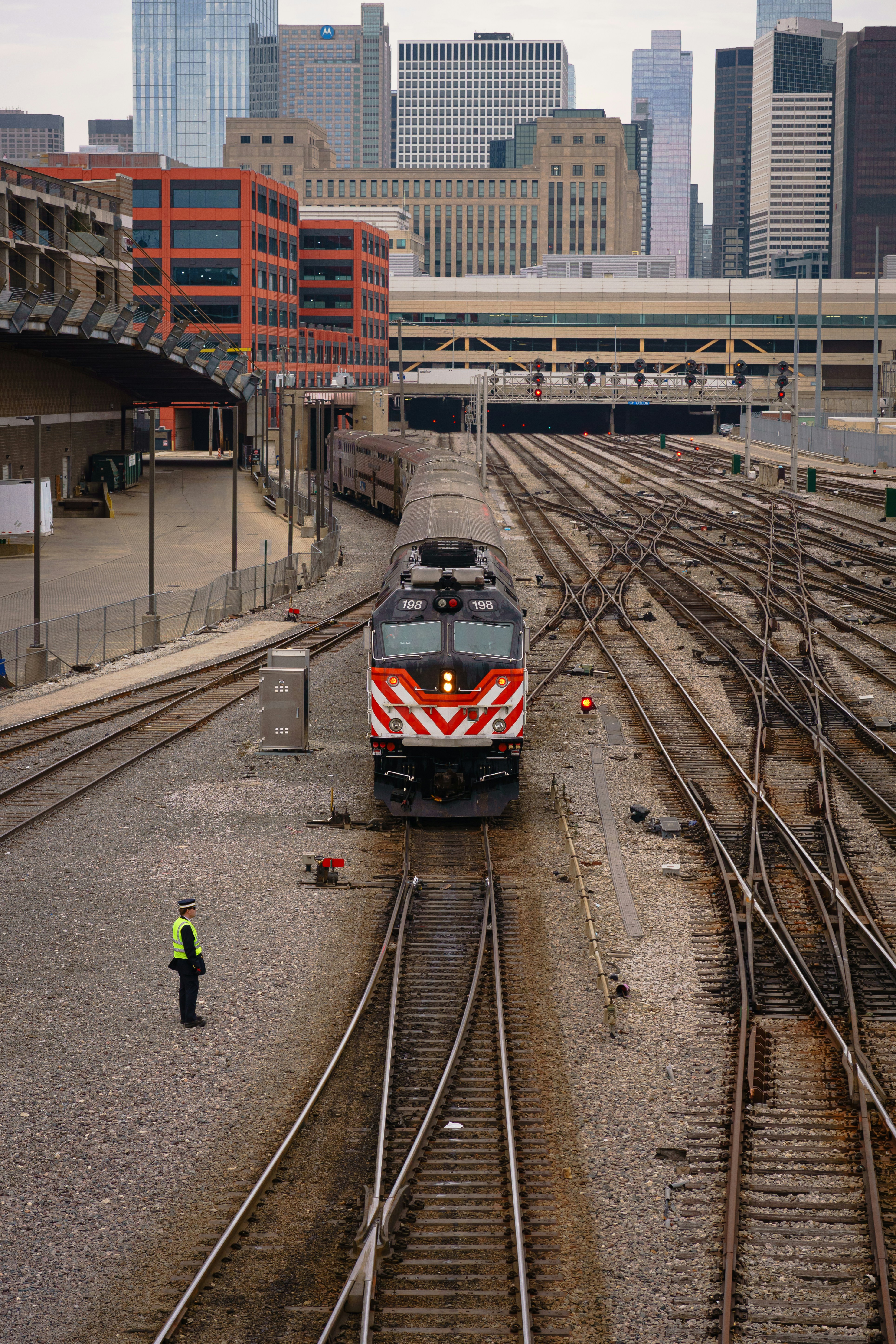Locomotive in the City: A Rail Yard Moment Beneath Skyscrapers