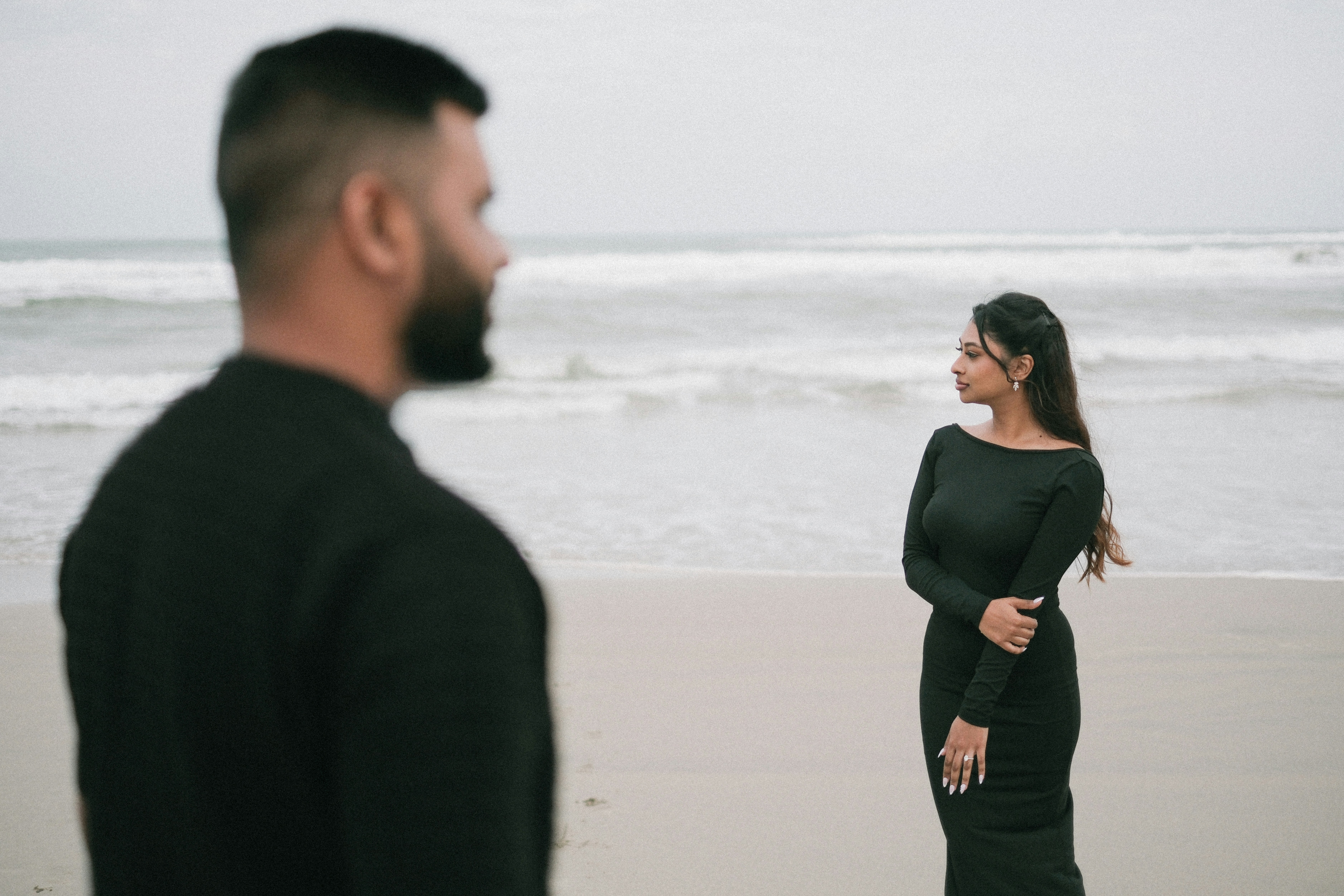 Contrasting Silhouettes: A Quiet Moment on the Shore