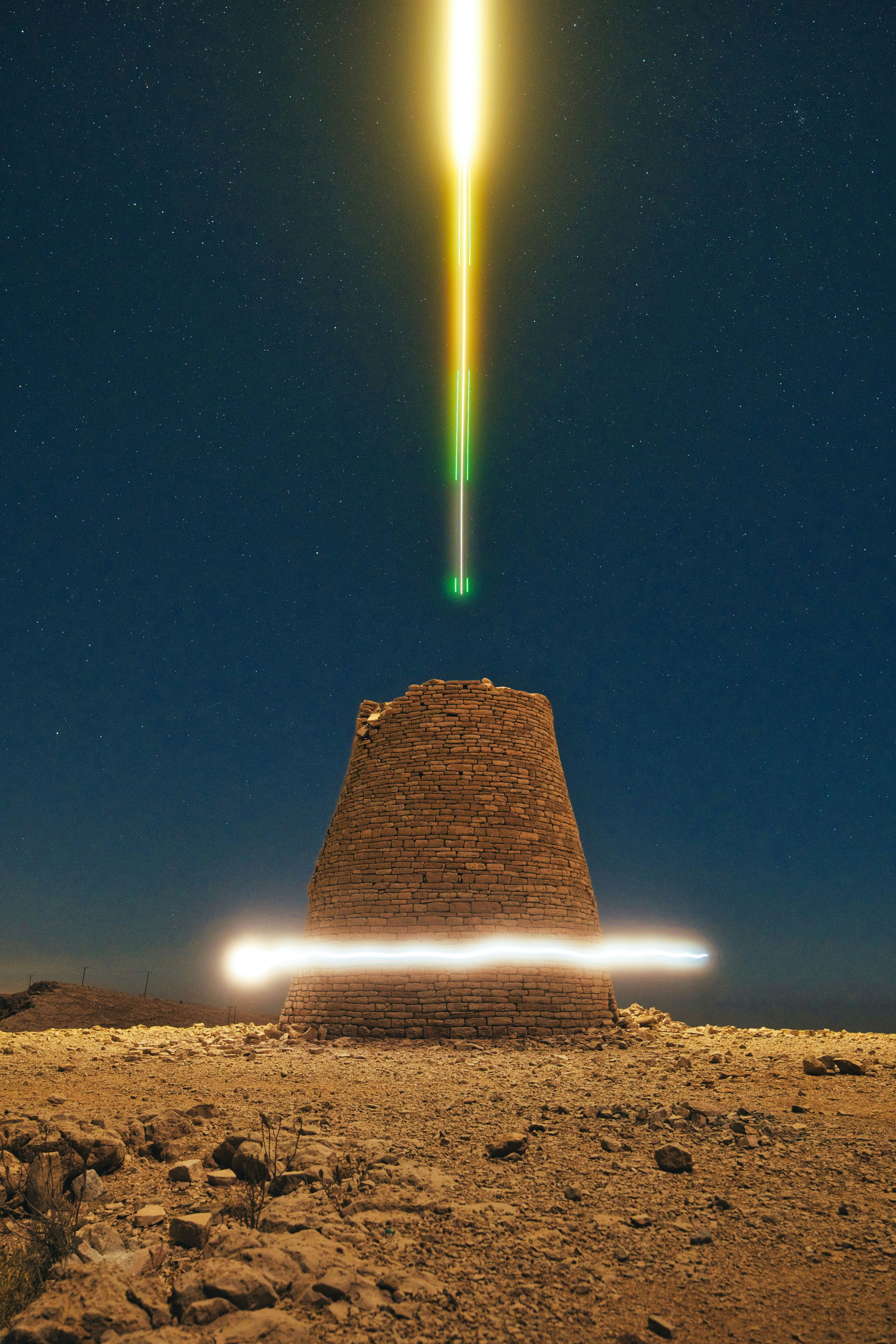 Star Trails Over a Stone Kiln: A Ray of Color Streaks Through the Night