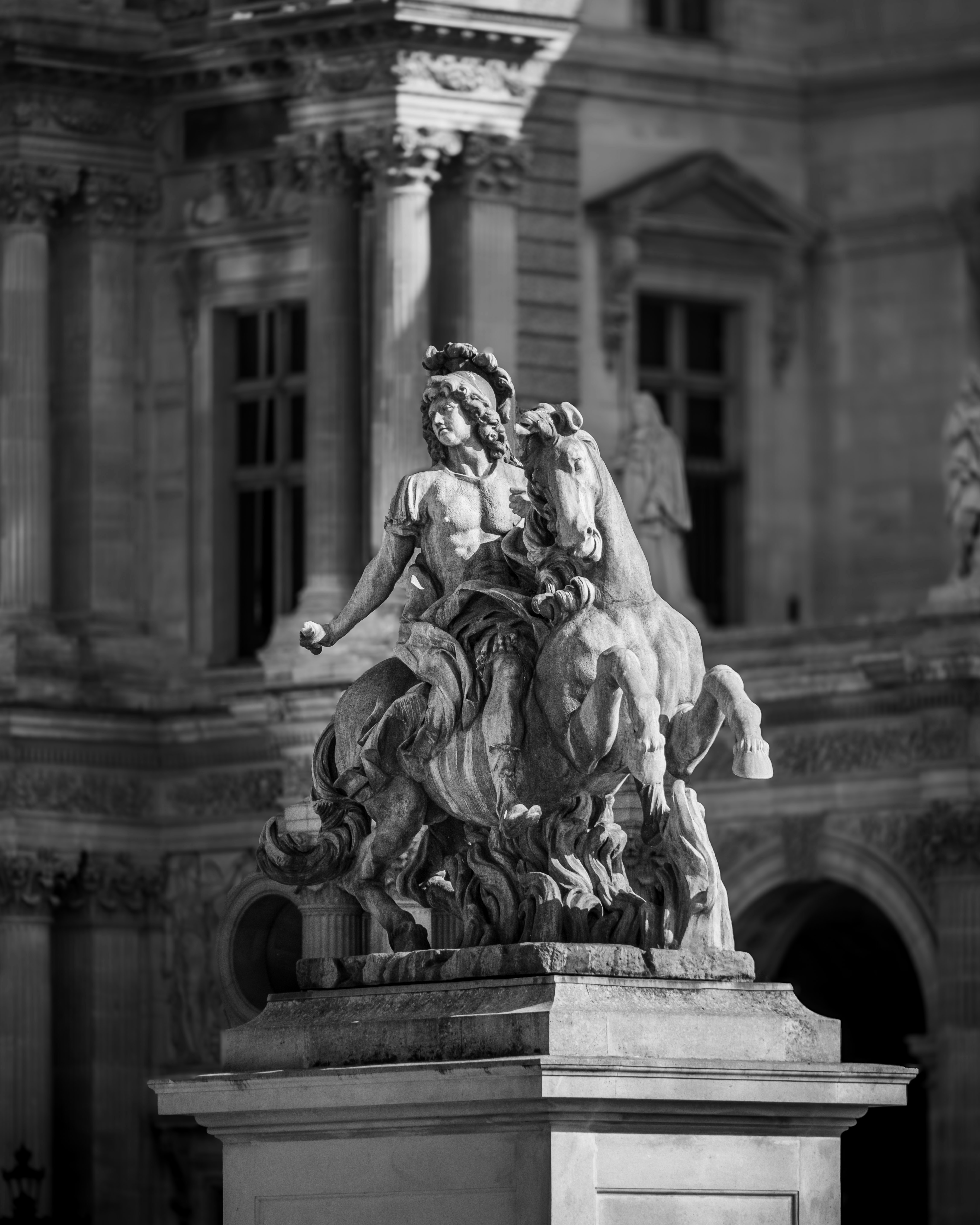 Equestrian Majesty: A Stone Rider Guarded by Historic Facades