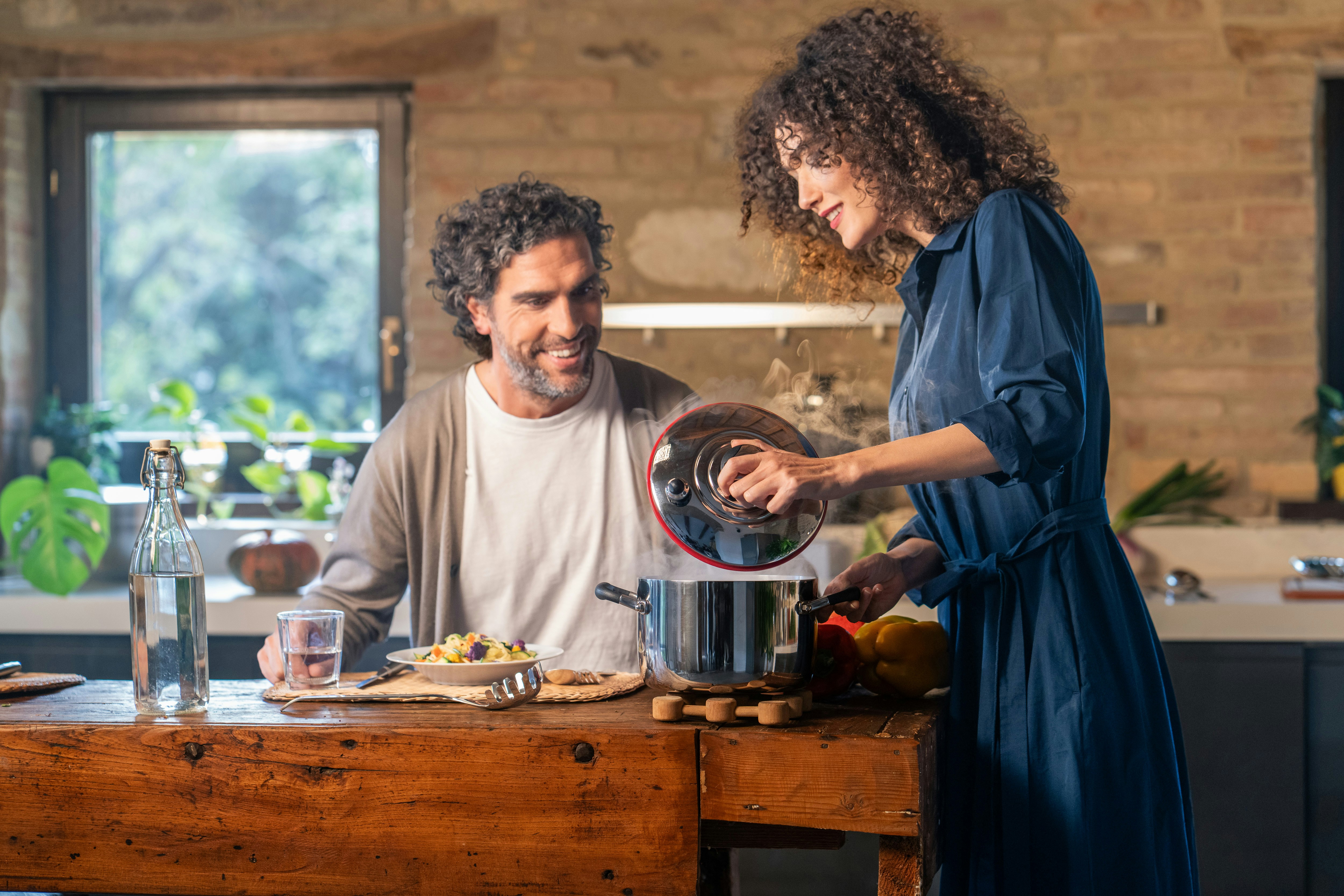 Kitchen Moment: Sharing a Pot as Light Streams Through the Window