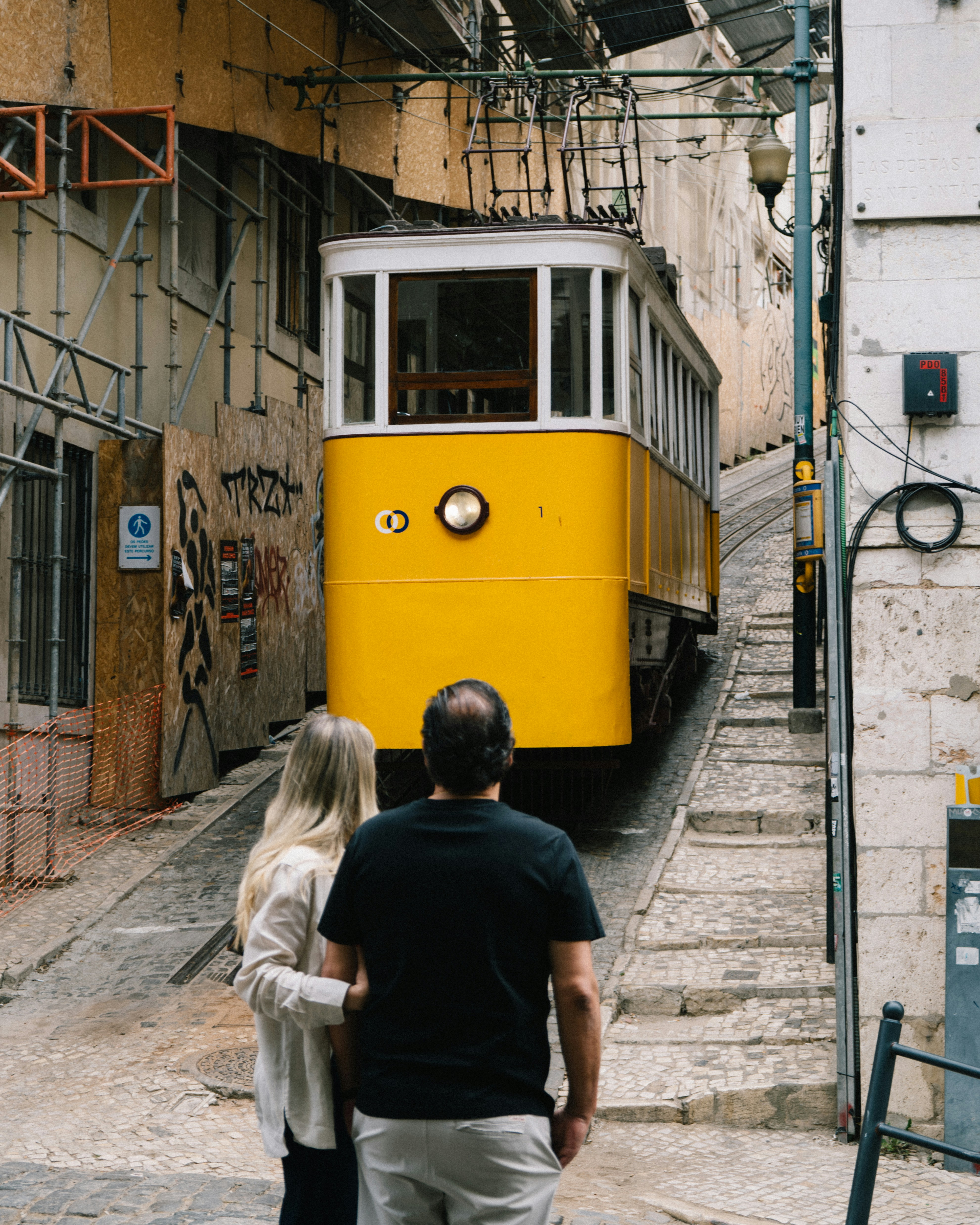 Golden Tram Sweeping Through a Quiet Lisbon Alley