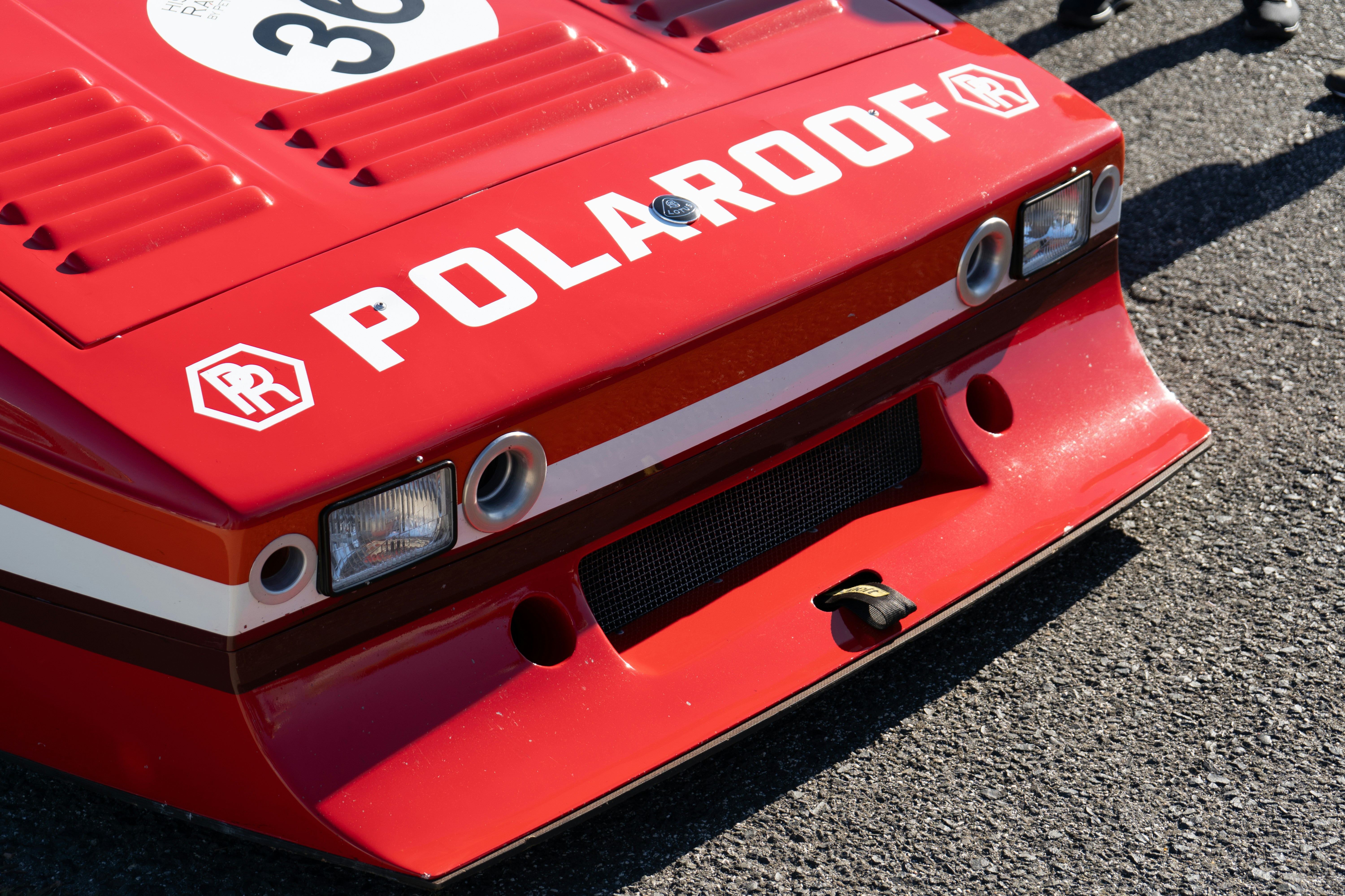 Red race car with polaroof logo. photo – Free Sports car Image on Unsplash
