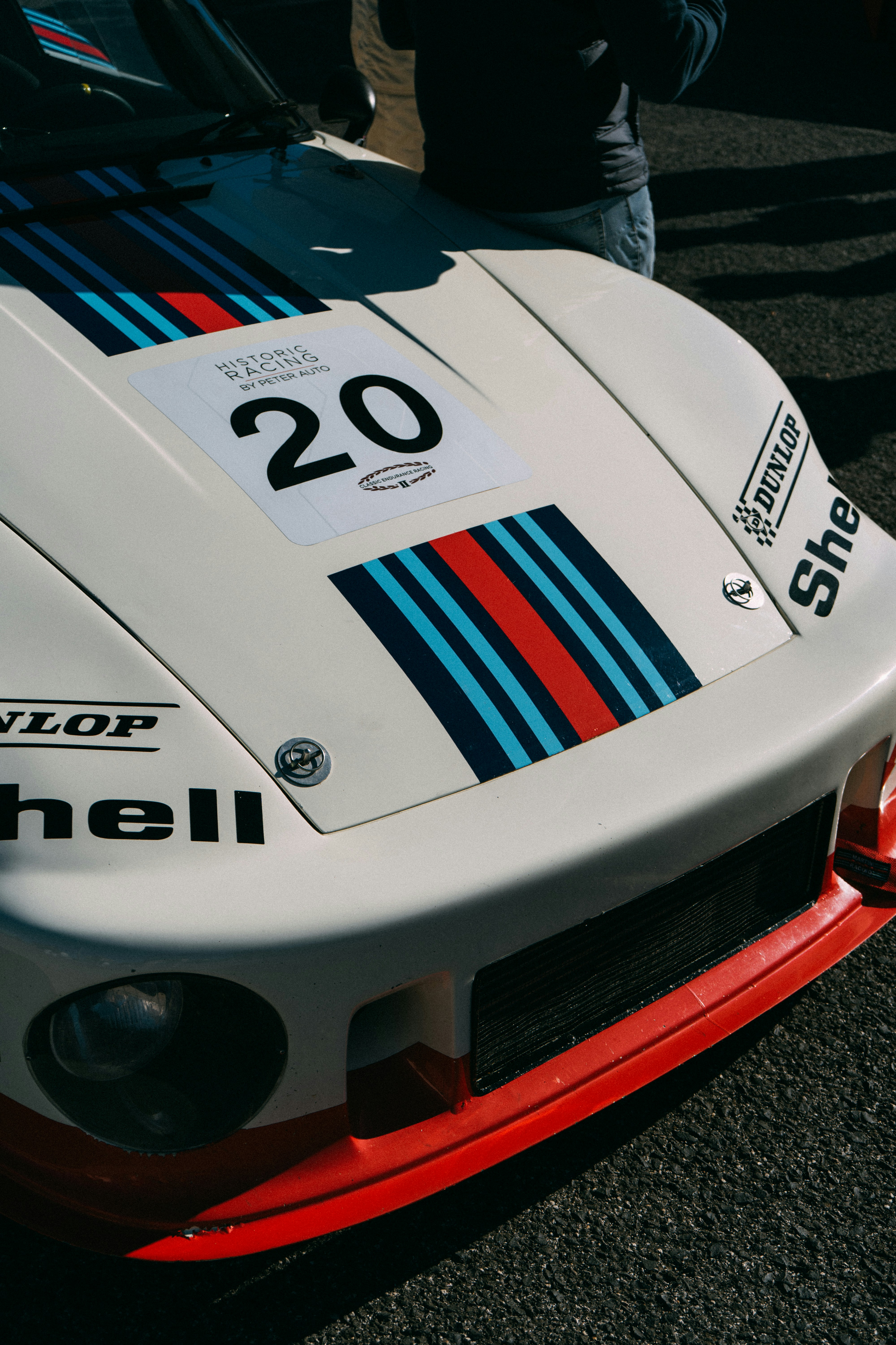 Open-Hood Racer: Vintage Racing Livery Under Stadium Light