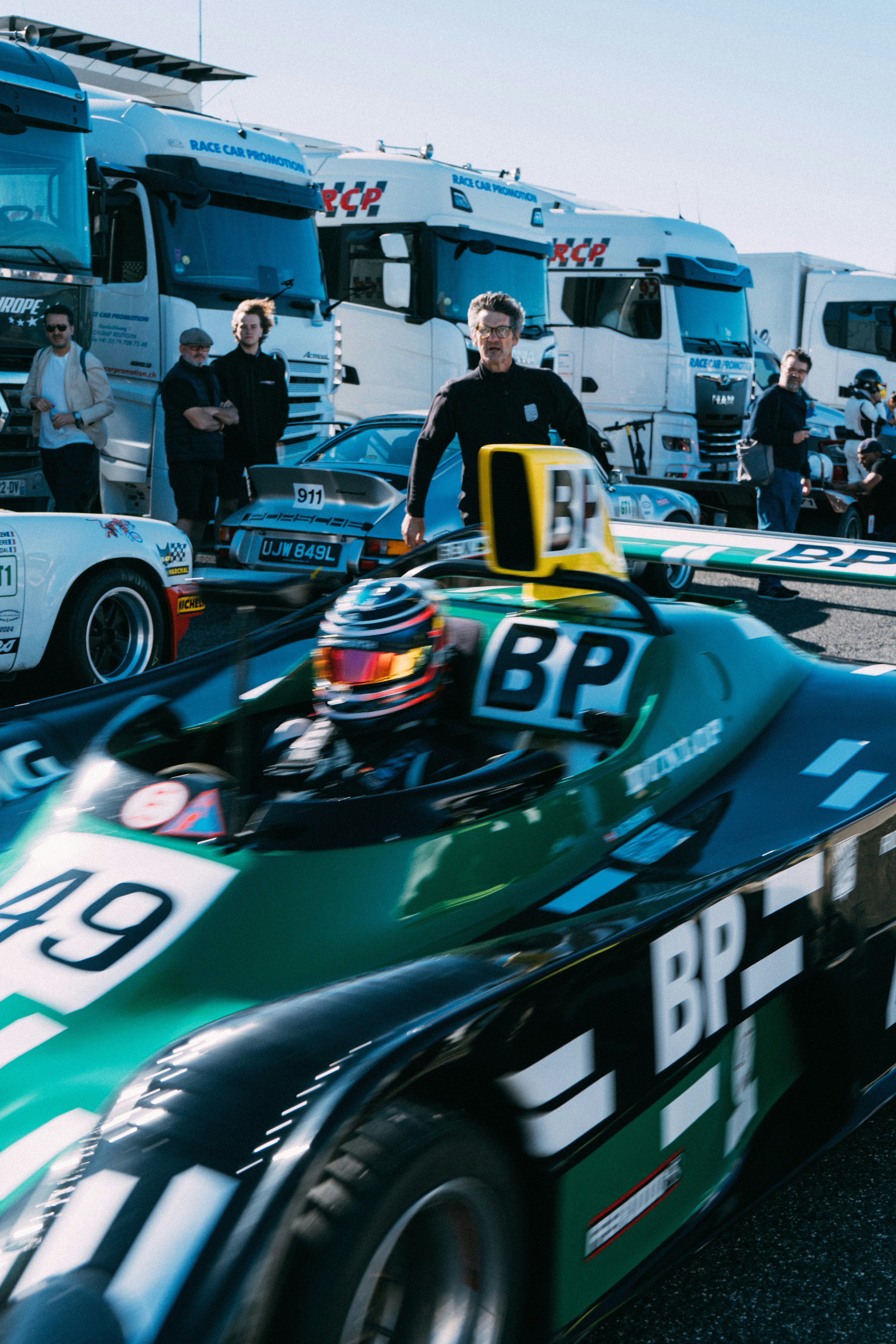 Green Formula Racer at Speed: BP Livery in the Pits